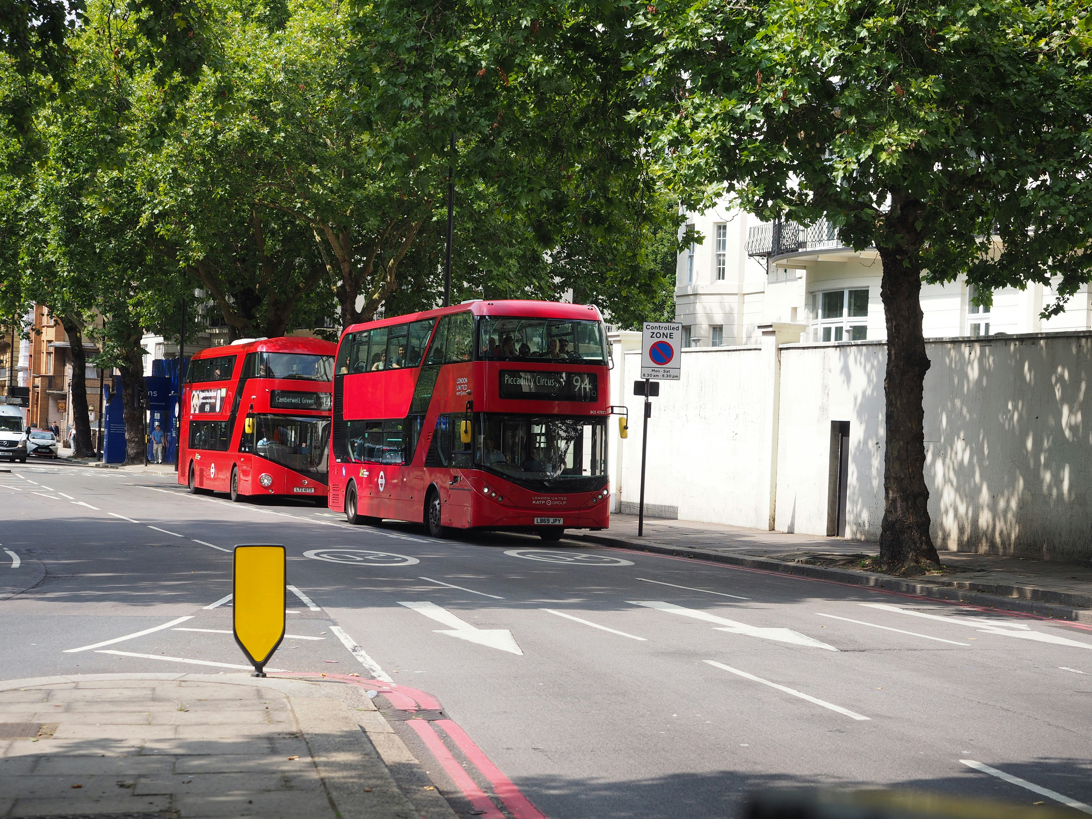 Red City Buses on a Quiet London Street