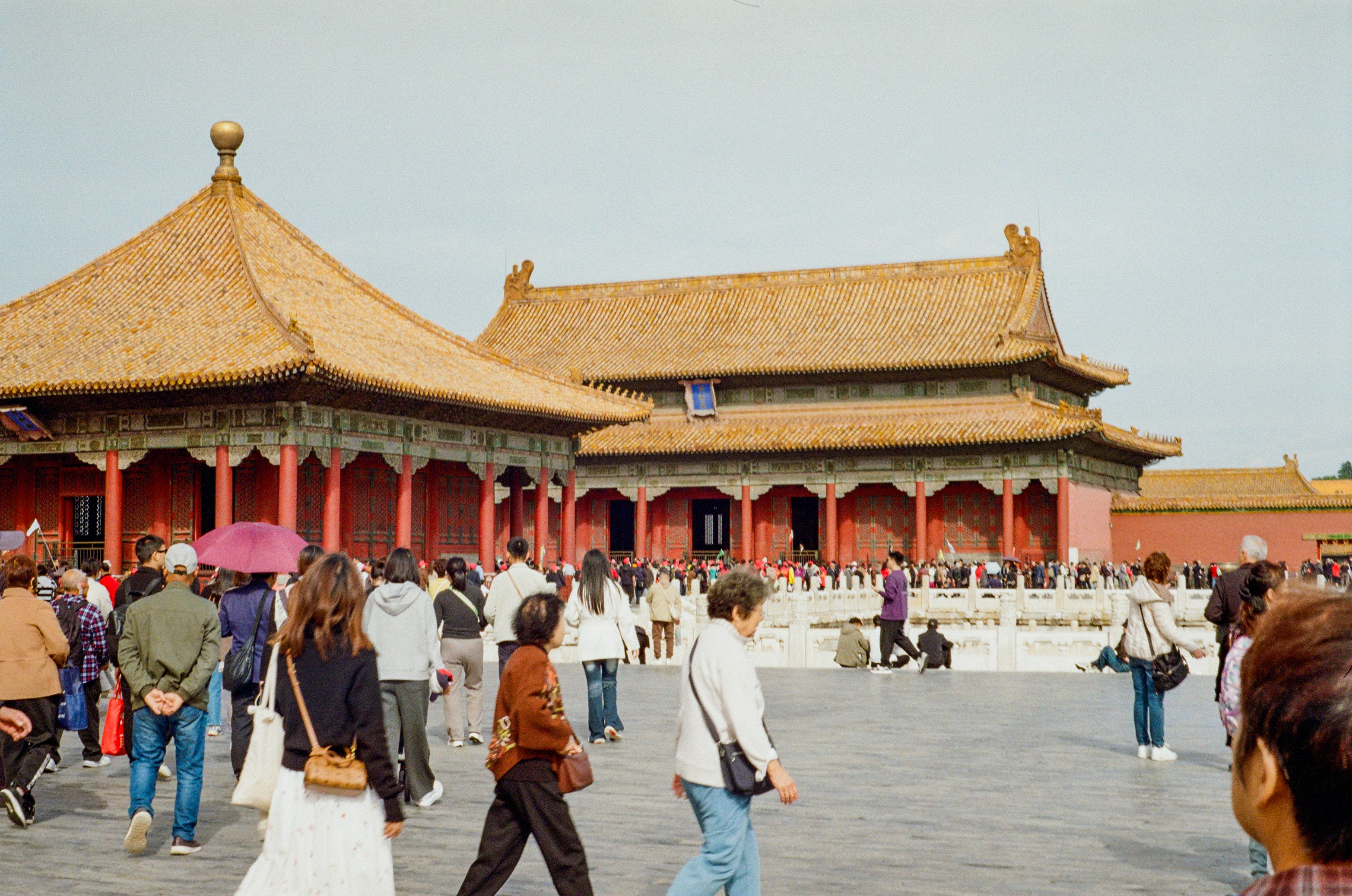 Tourists walk through the forbidden city courtyard in beijing. photo ...