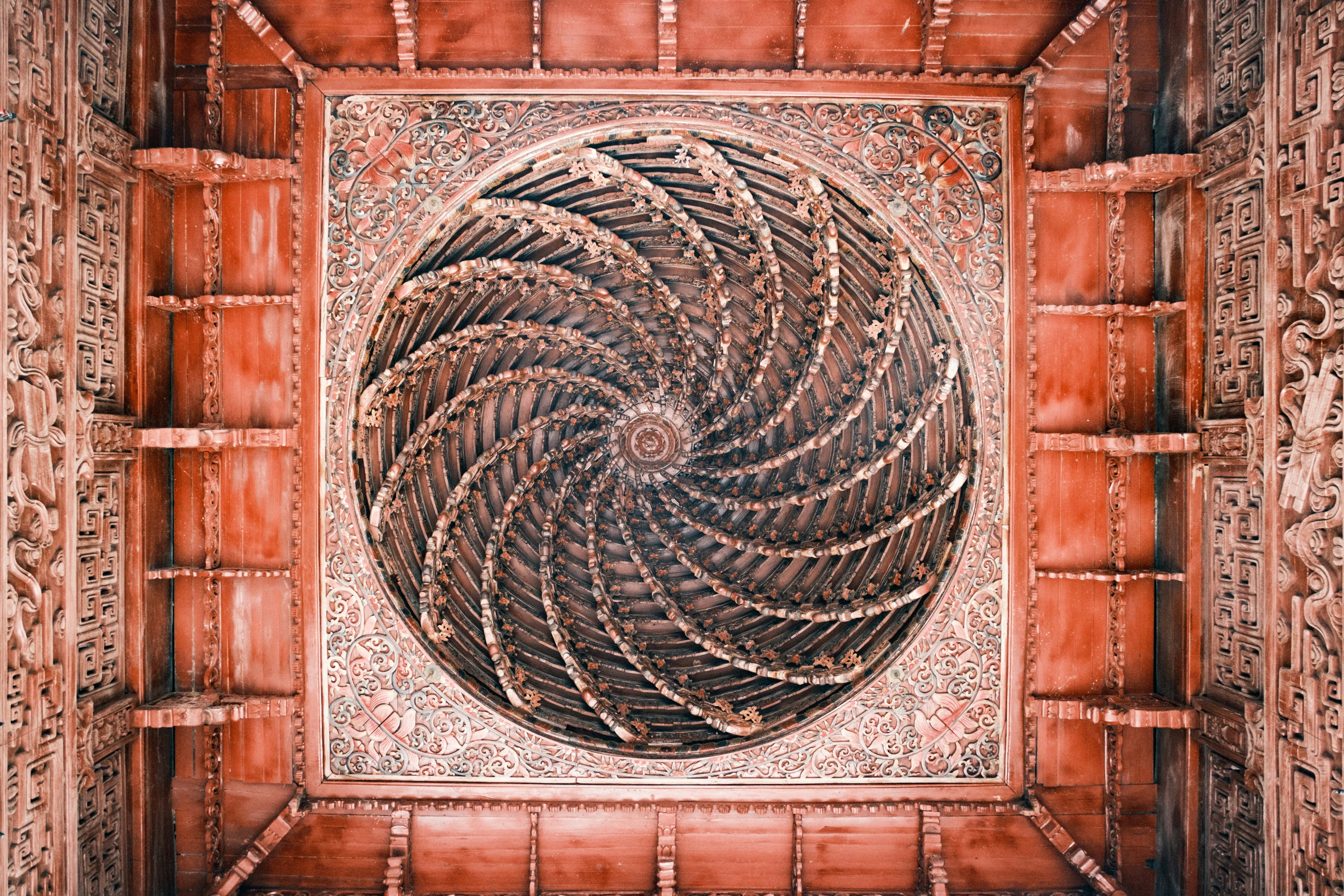 Spiral Vortex: A Red-Ceramic Ceiling Tapestry