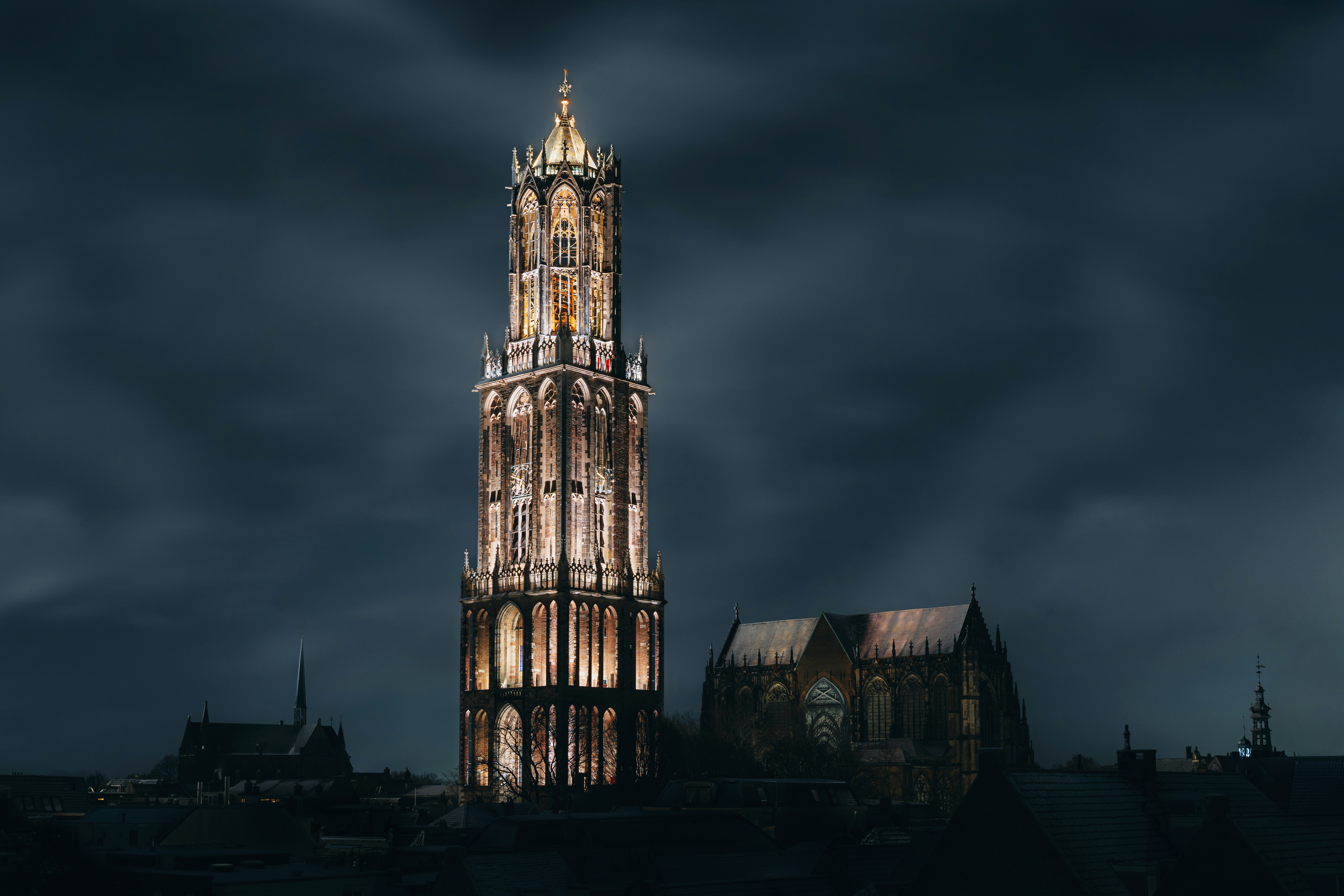 Moonlit Gothic Tower Rising from the City Roof