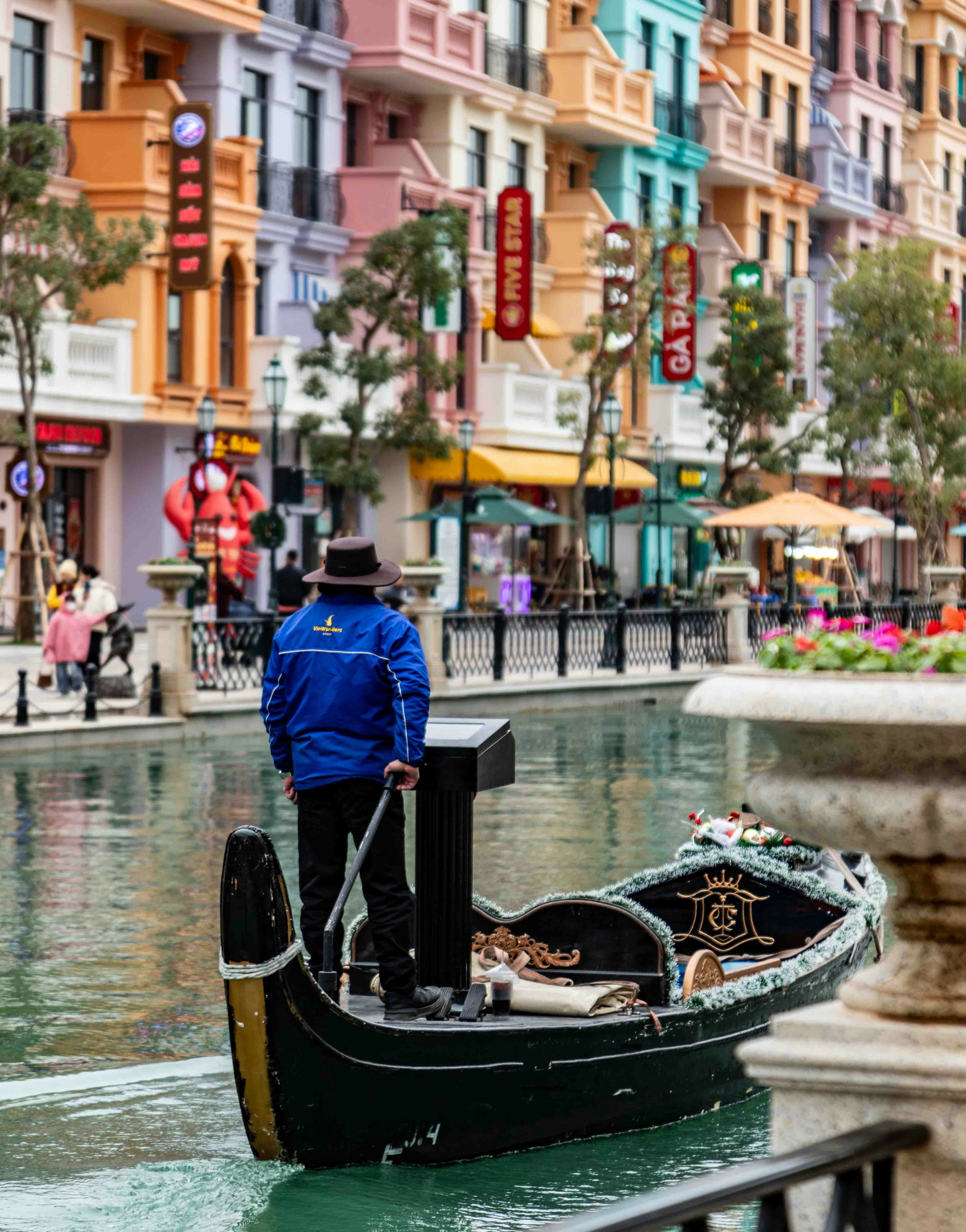 Gondolier at a Colorful Canal Street