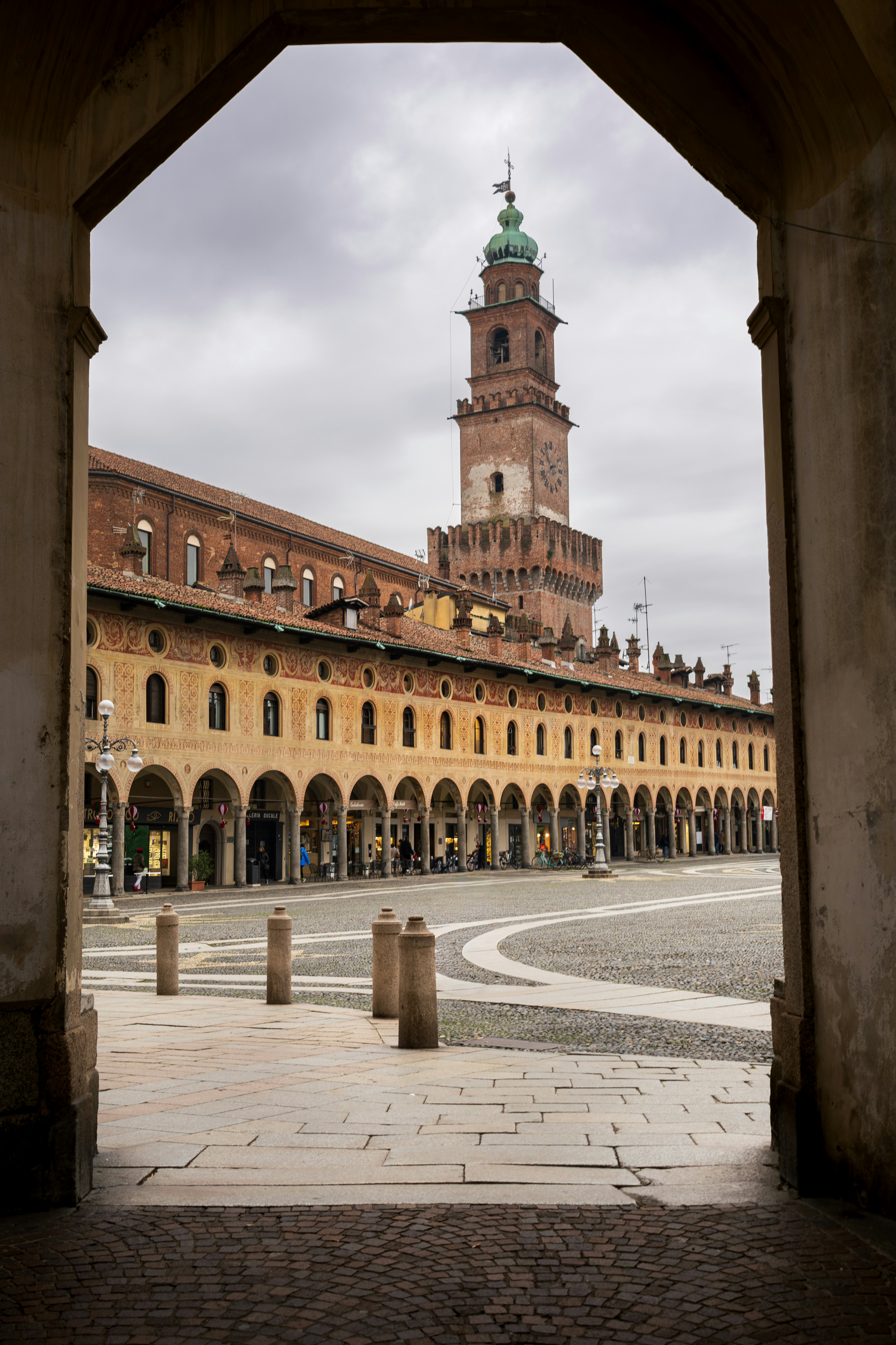 Arcade of Arched Shadows: A Towered Silhouette Framed by Converging Perspectives