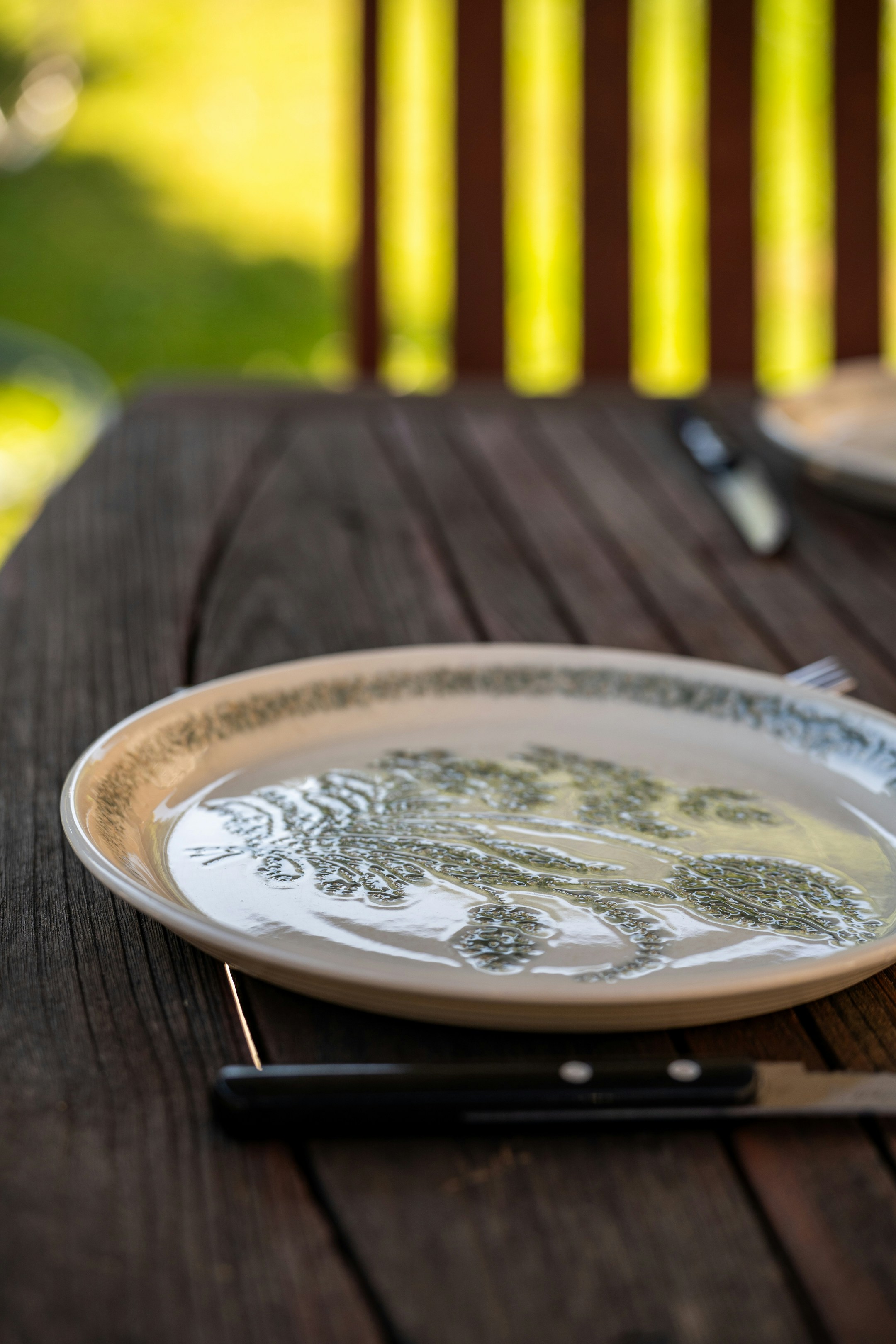 Palate of Wood: A Dinner Plate Resting on a Rustic Deck