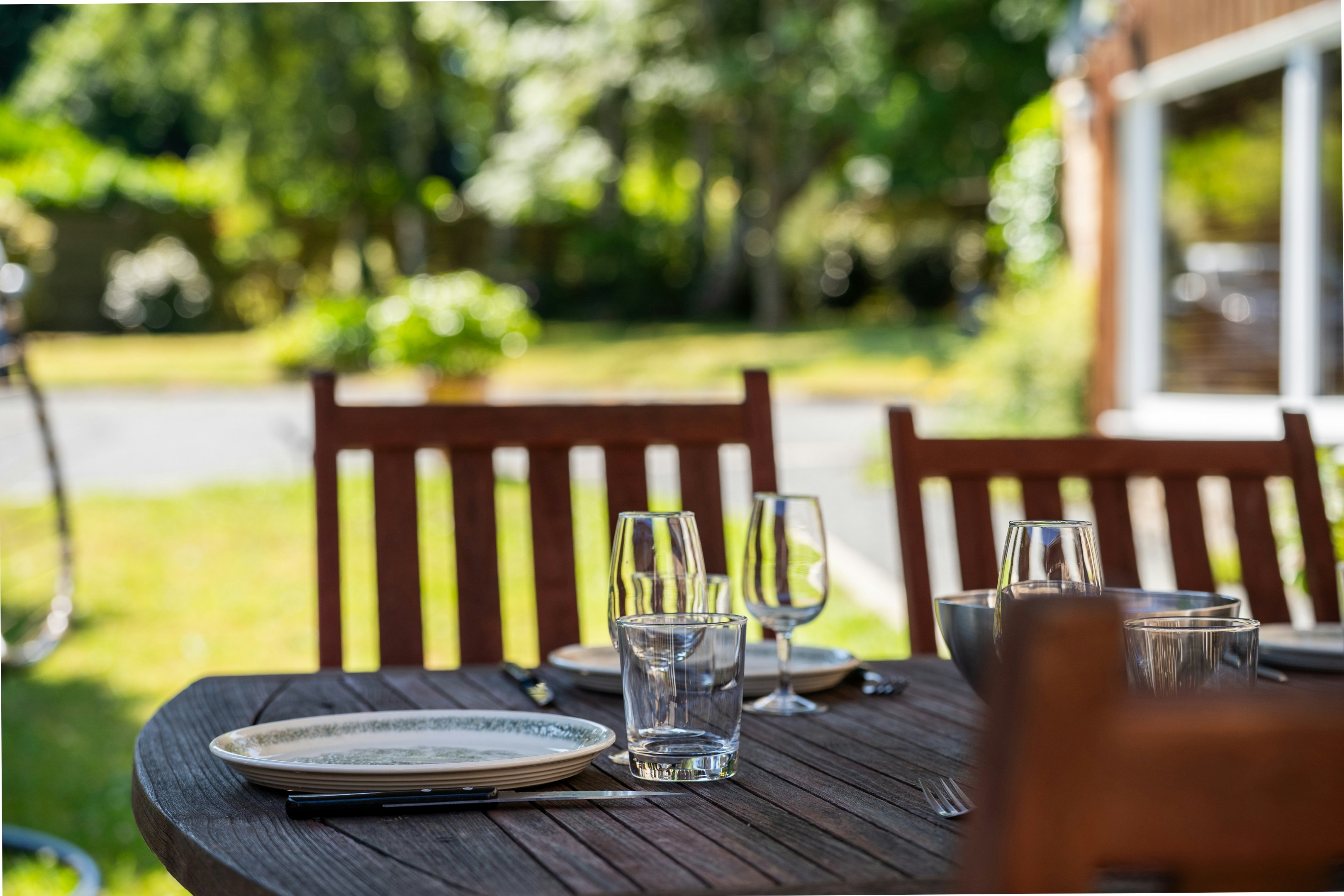 Sunlit Outdoor Table Set for a Casual Afternoon