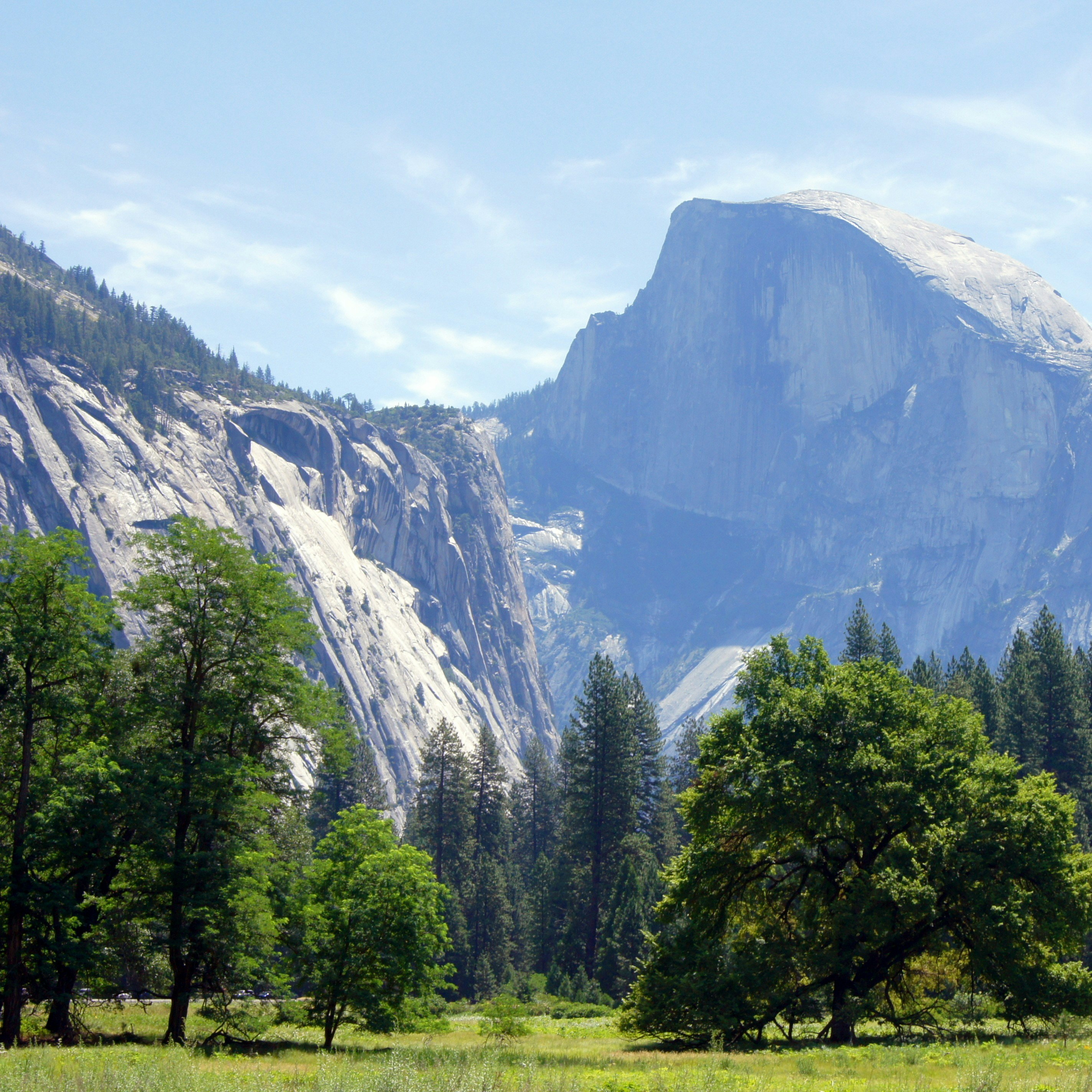 Majestic half dome mountain peak under a clear blue sky.