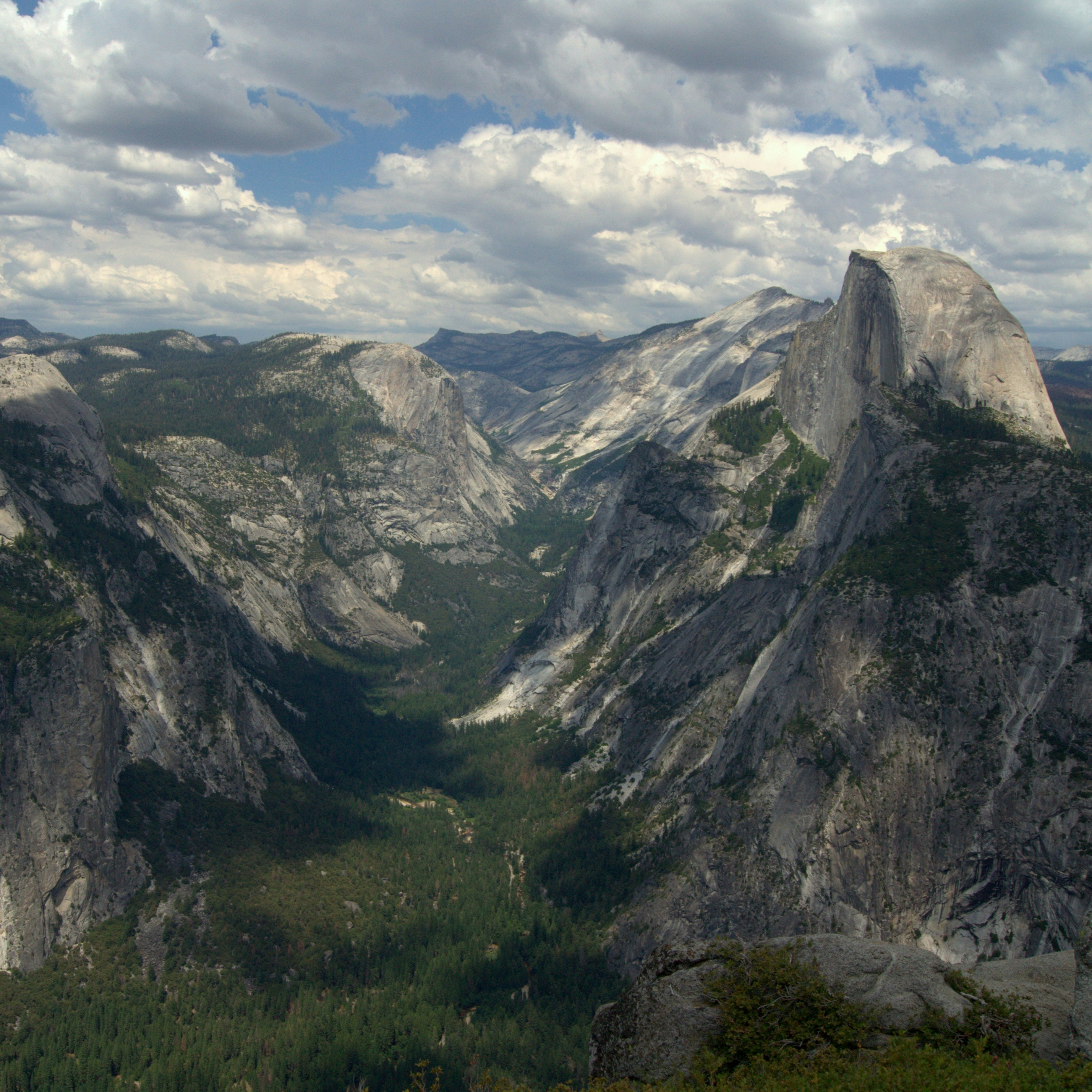 Majestic yosemite valley with half dome under clouds