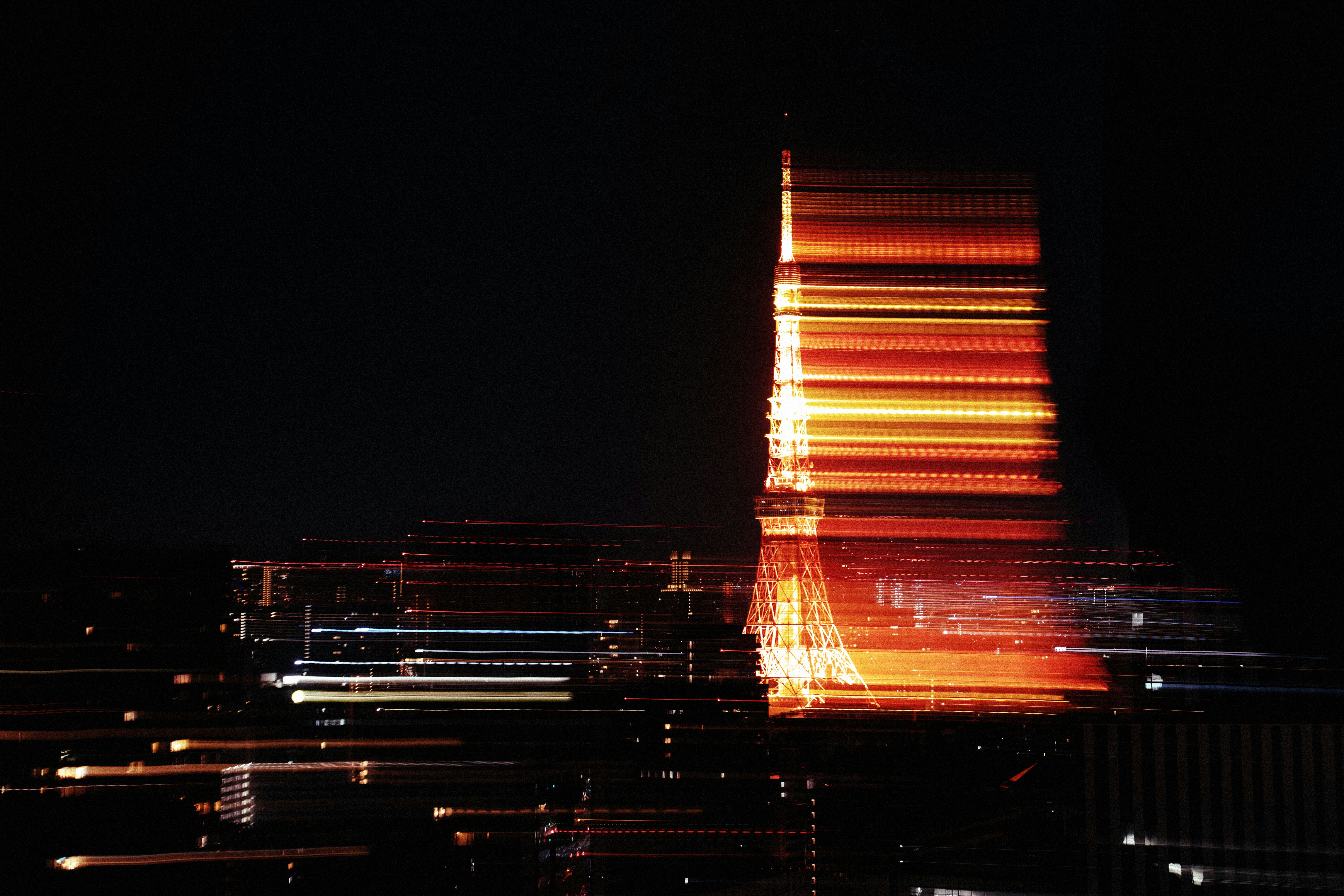 Neon Cascade: A Blurred Night of Tokyo-Style Skyline