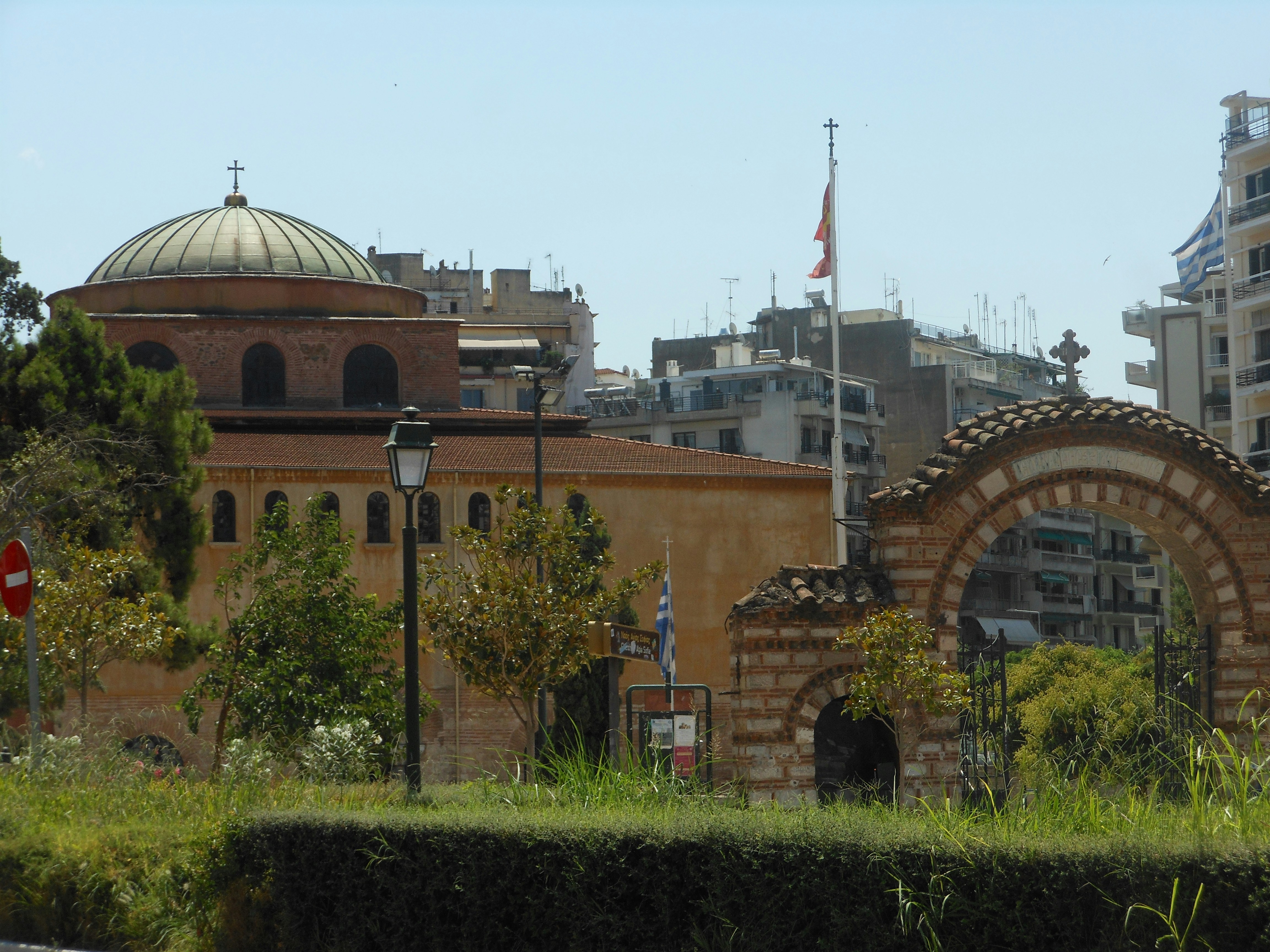 Ancient church with dome and arched entryway.