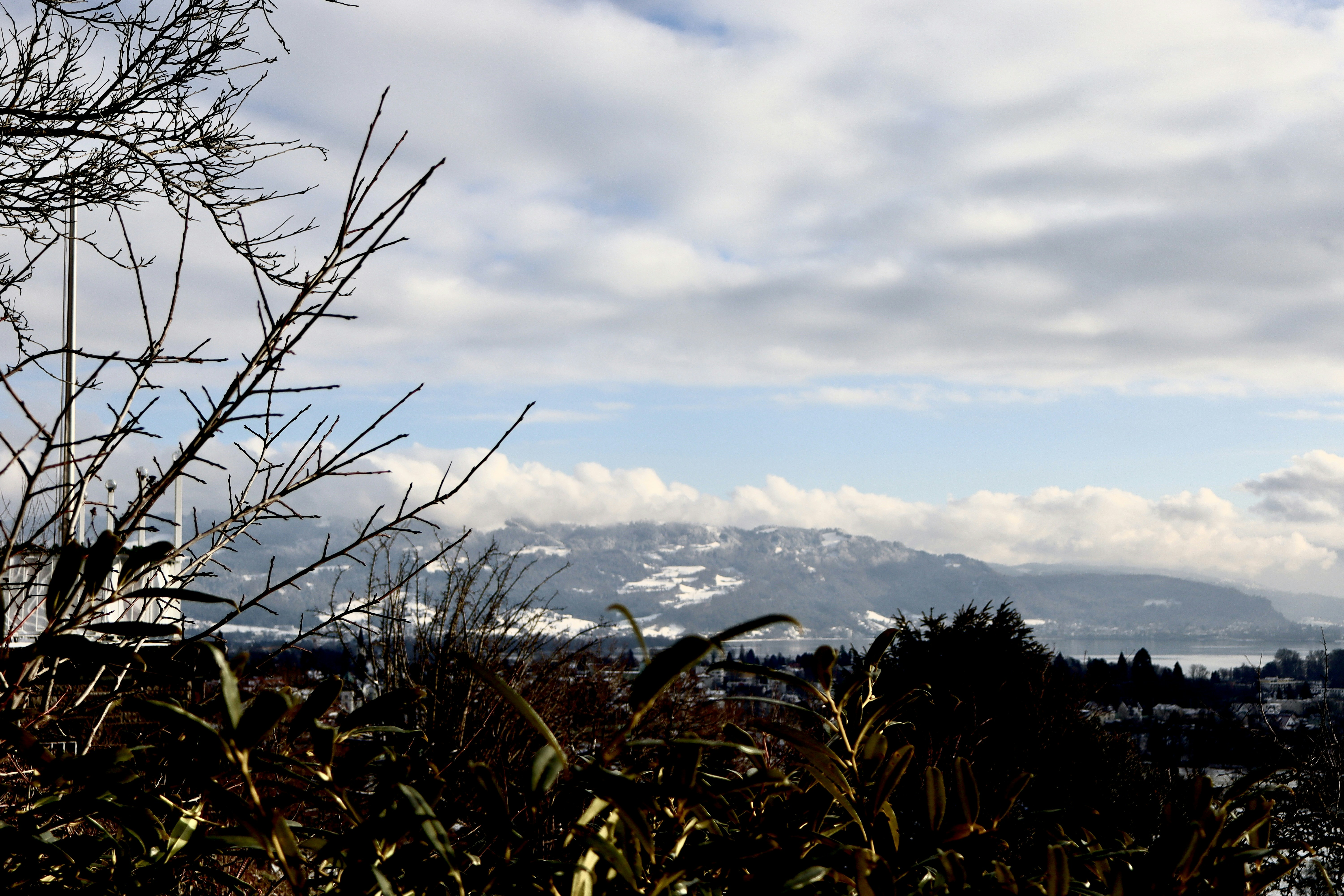 Snow-covered mountains under a cloudy sky