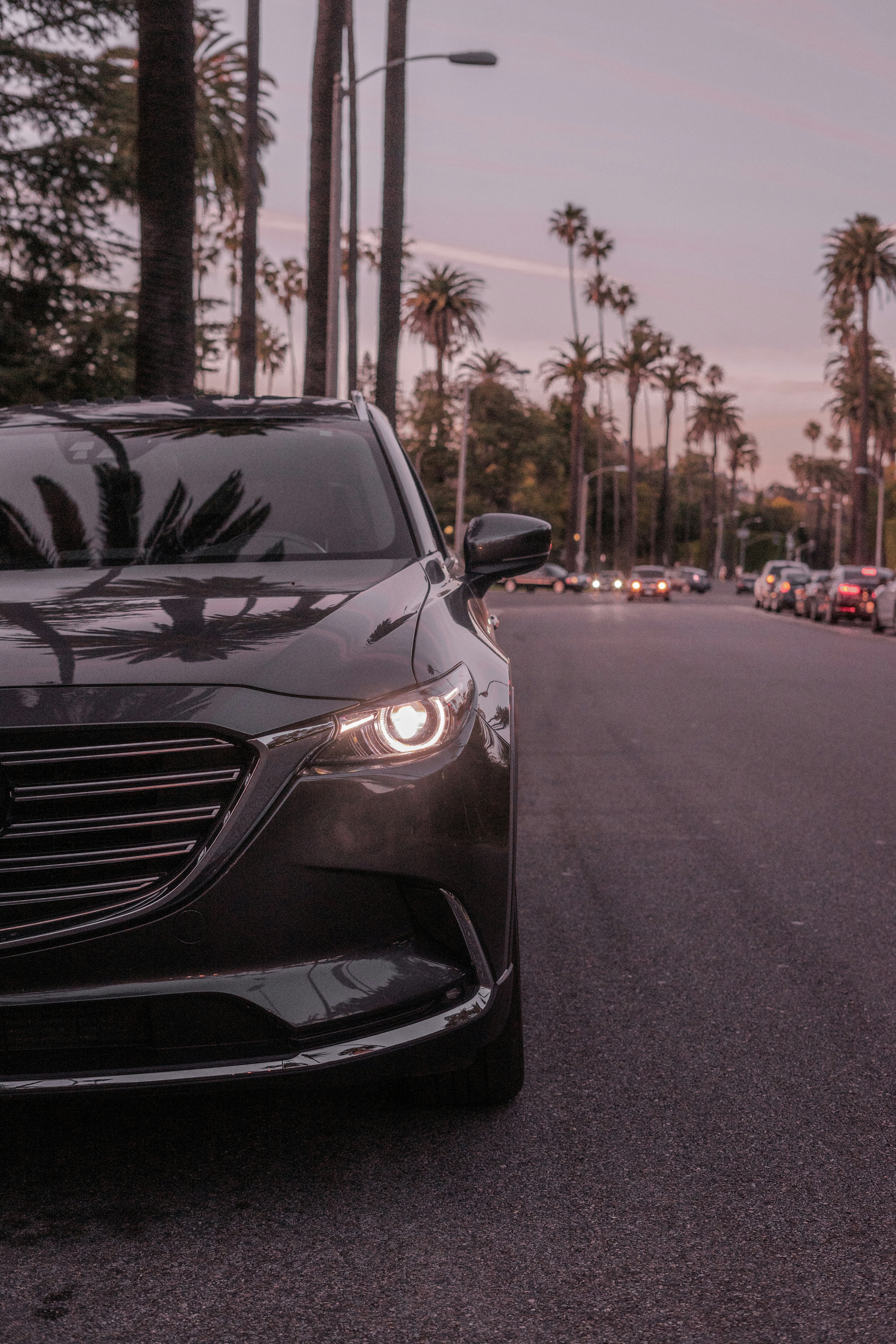 Front-Quarter Glare: A City Street Portrait of a Dominant Grille