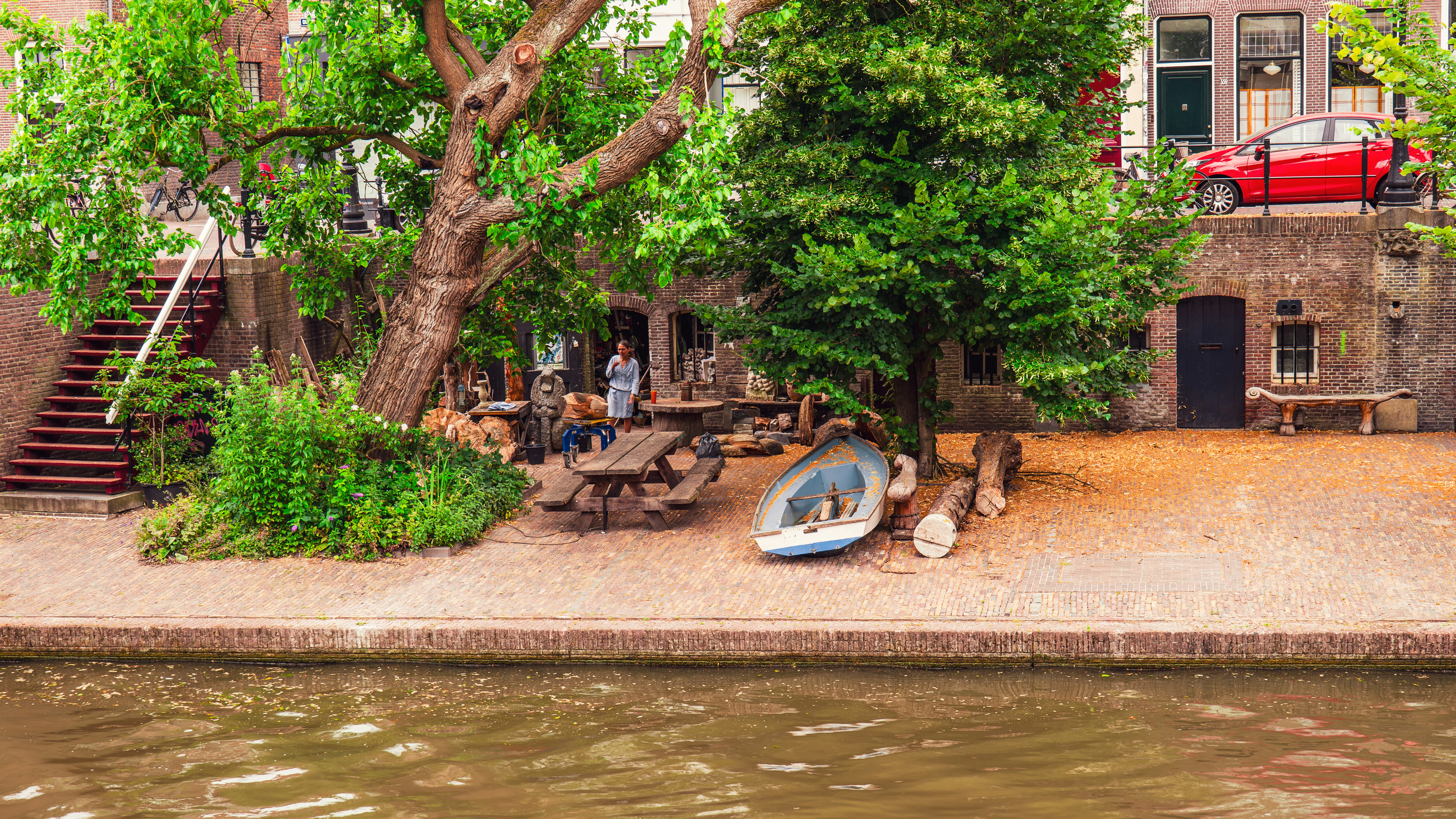 Canalfront Cafe Beneath a Mature Linden