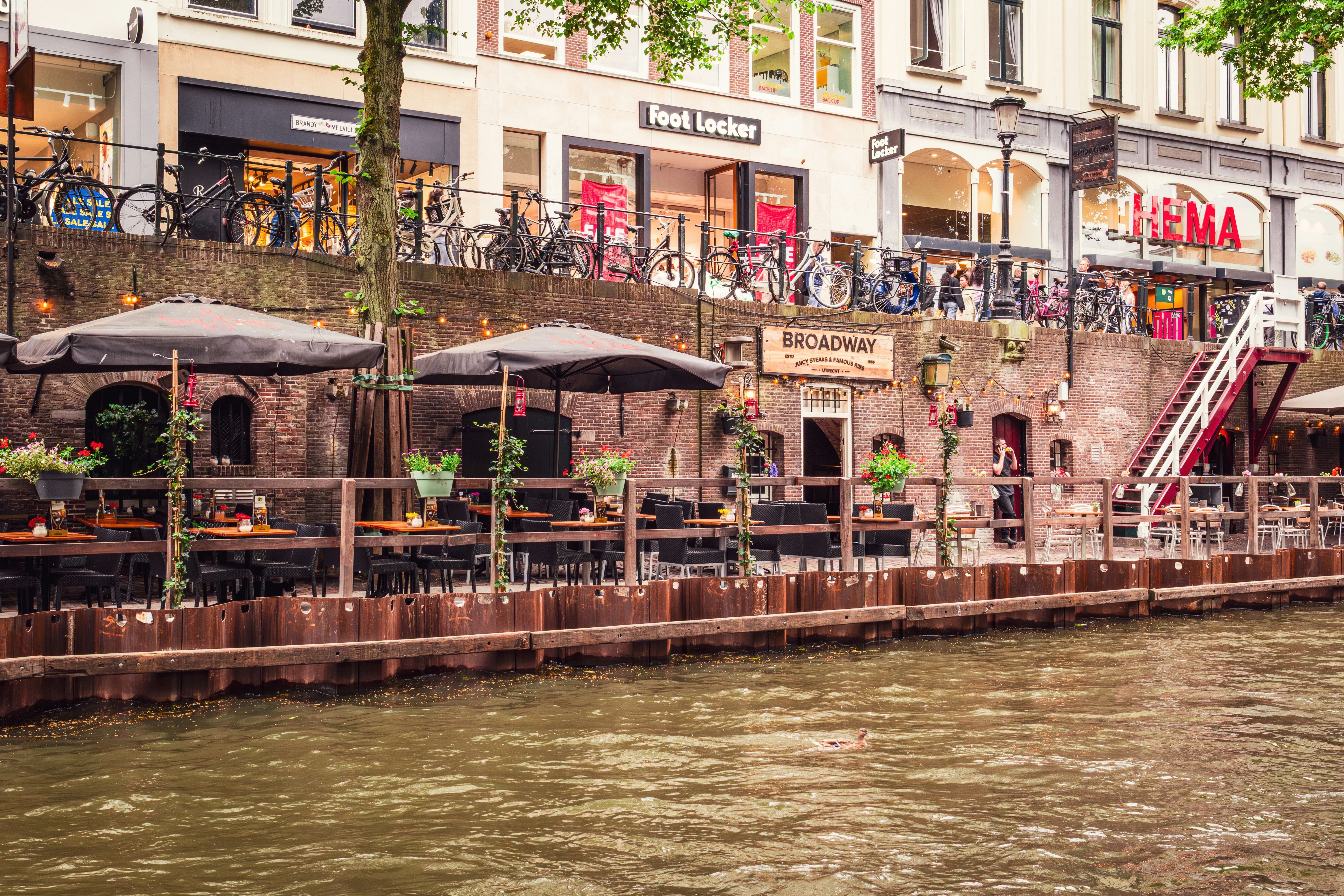 Canal-side Café Rows and Bright Facades under a Dutch Afternoon