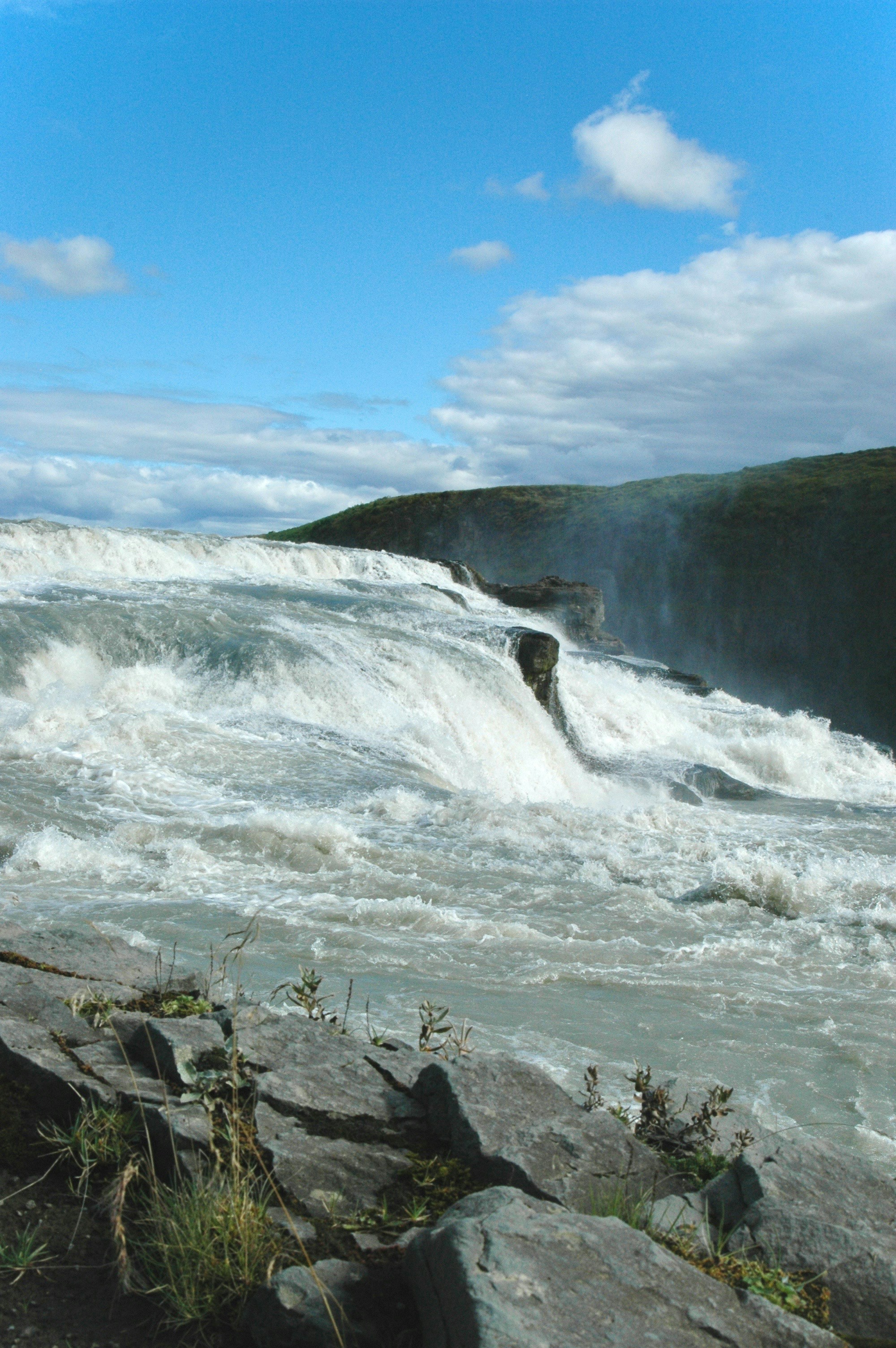 Rushing Cascade Against Cliffside Blue