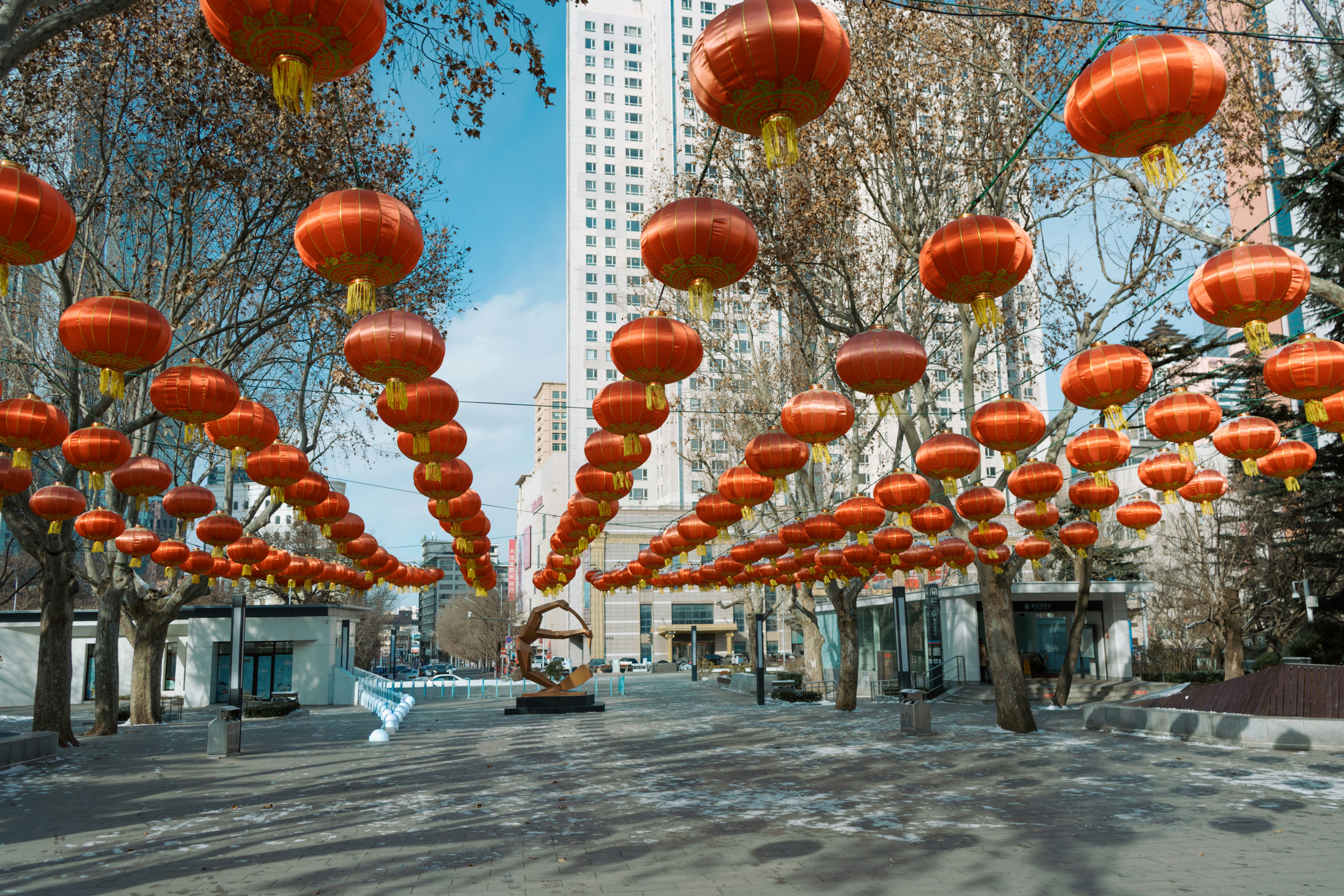 Lantern Avenue: Red Orbs Over a City Walk
