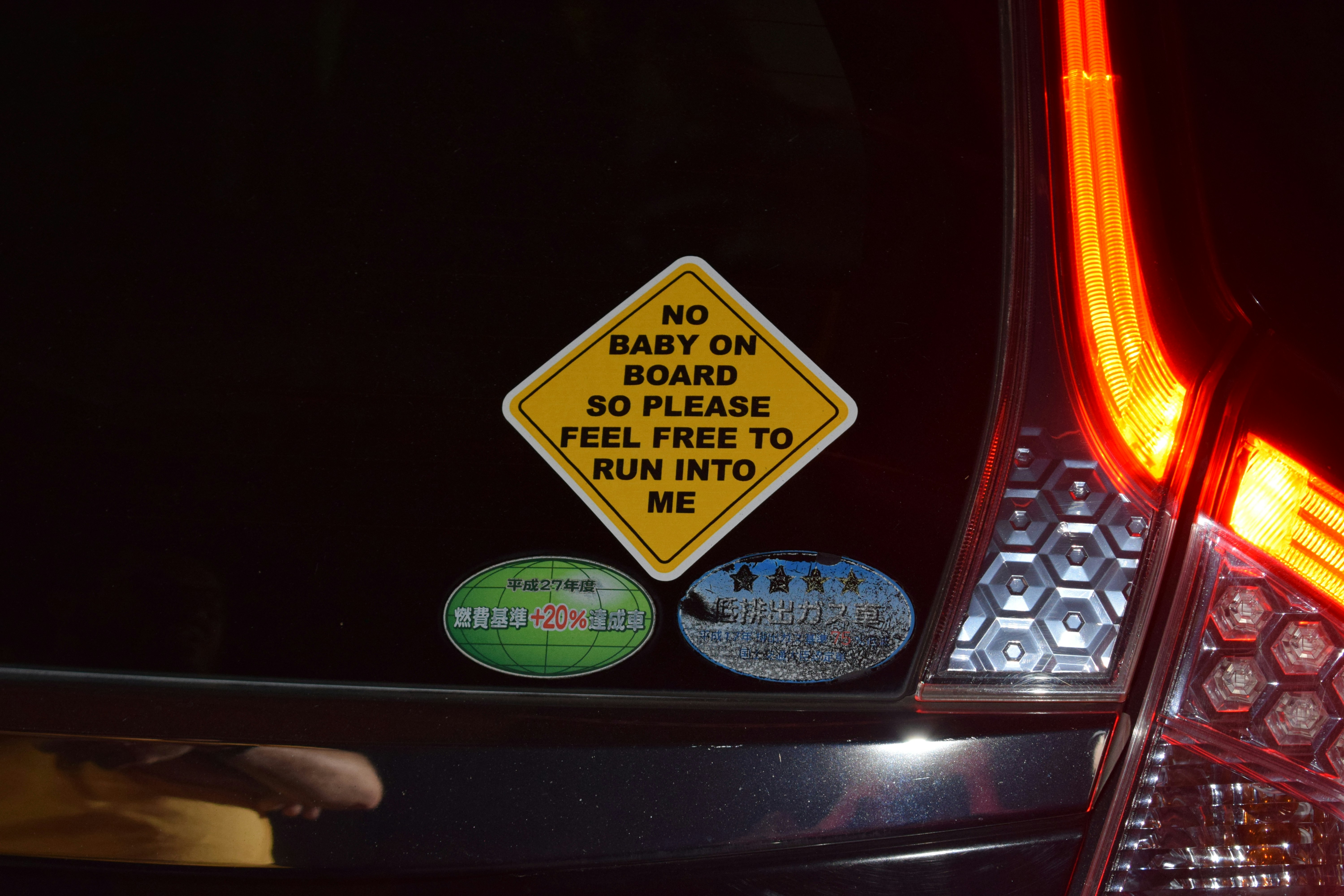 Diamond shaped sticker on car reads 'no baby on board' photo – Free ...