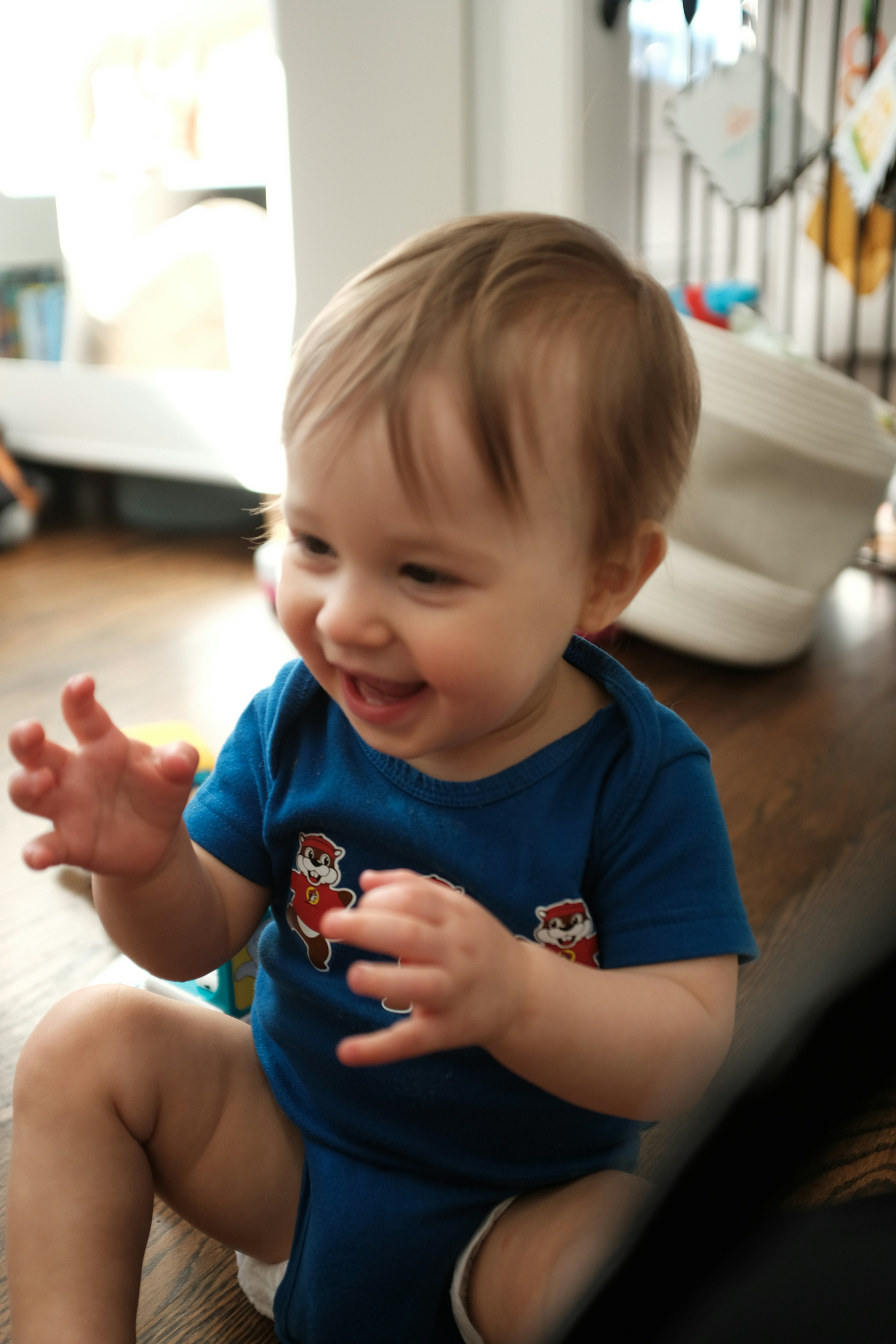Joyful Discovery: A Baby in Motion on a Hardwood Floor