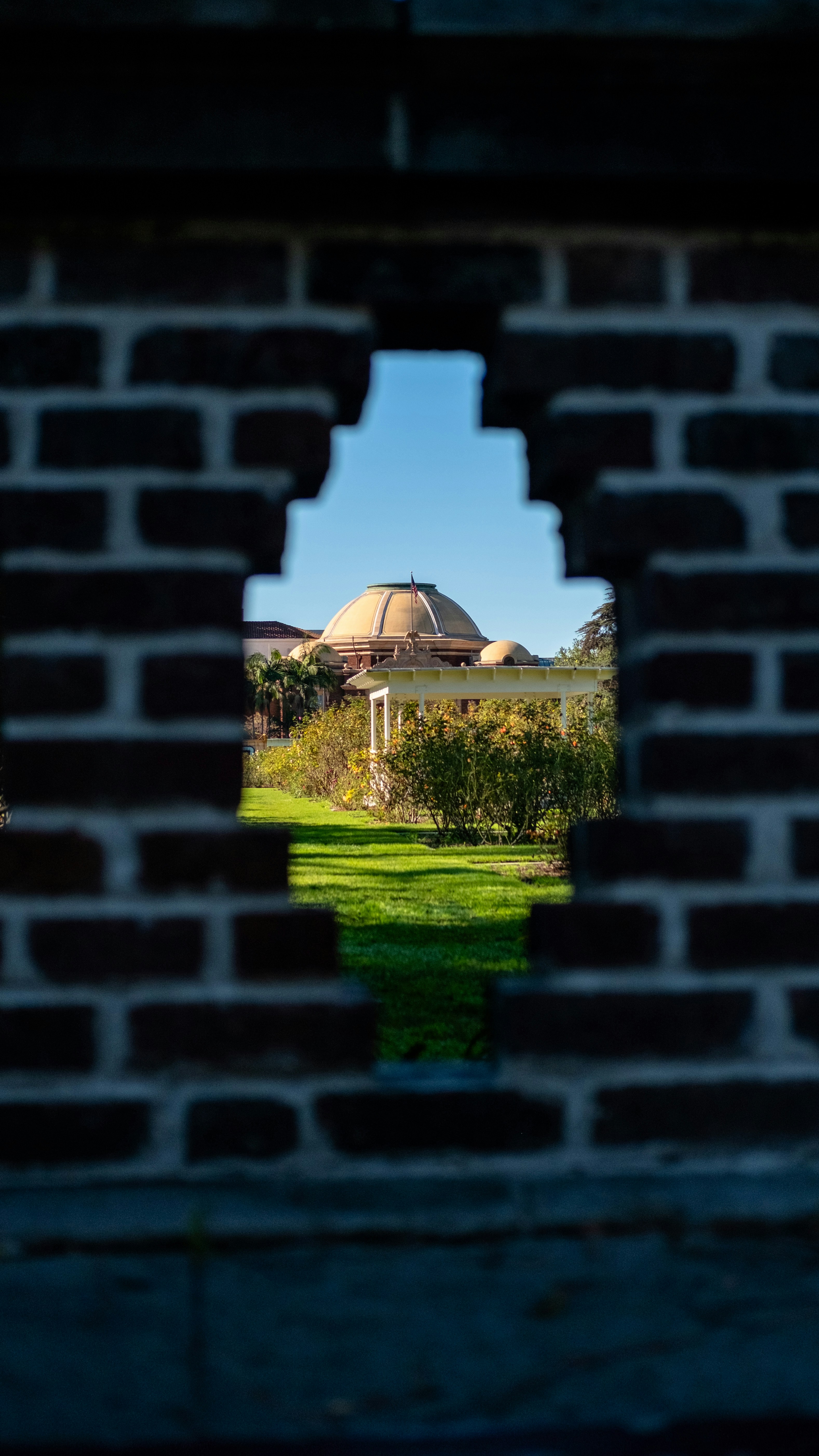 Through the Brick Frame: Dome and Garden View