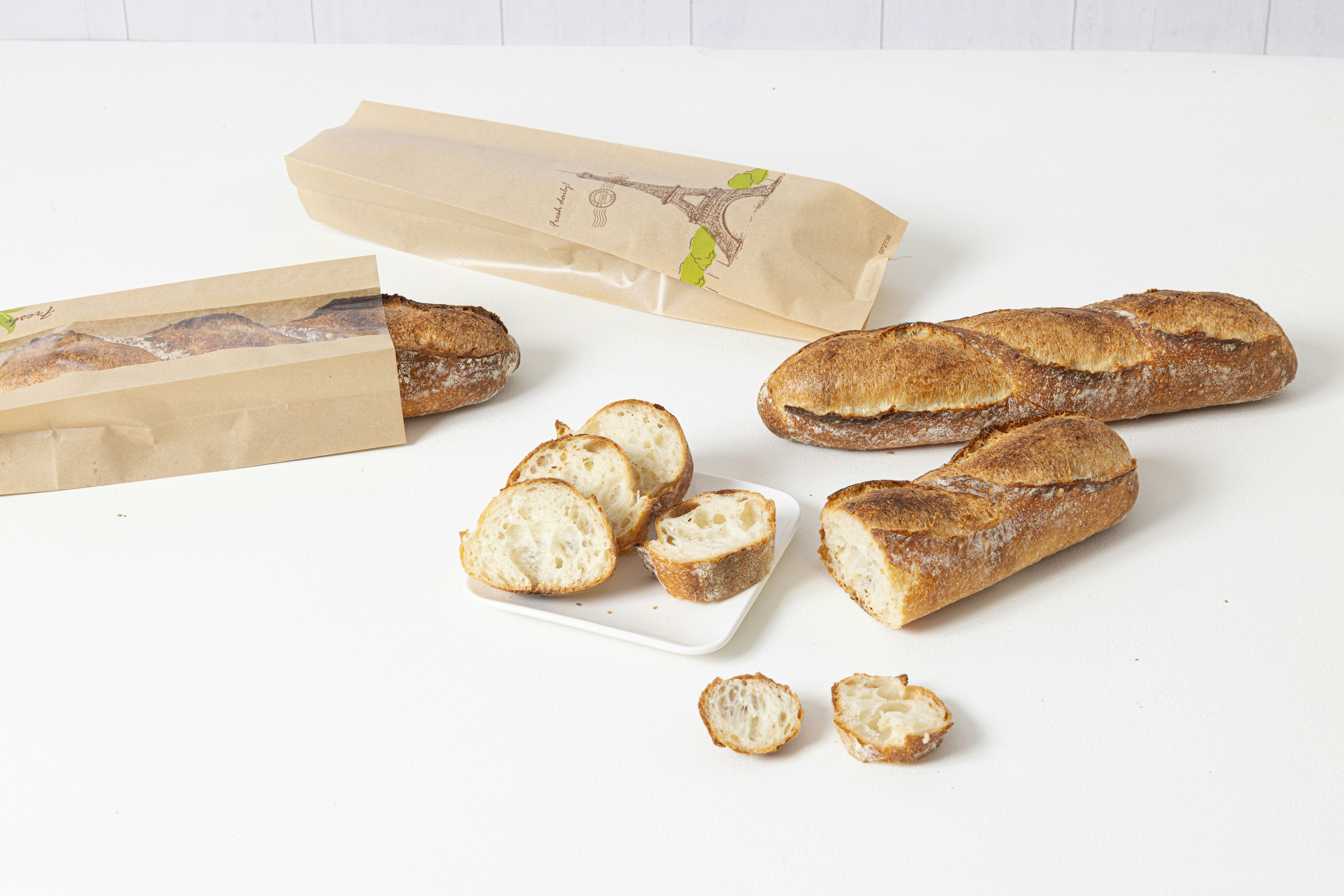 Crusty Baguette Quartet: Slices of Daylight on a White Counter