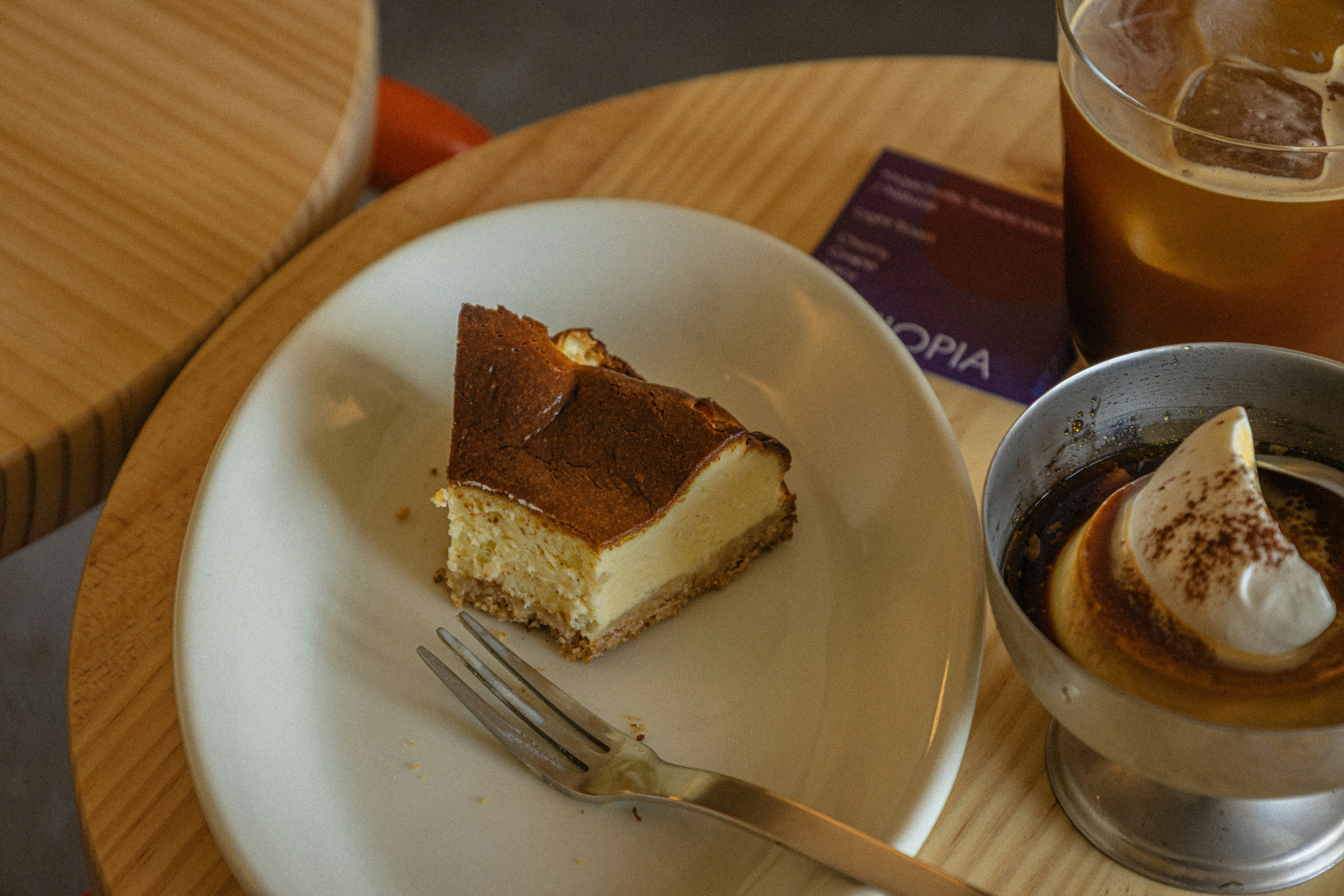 Cheesecake Slice and Whipped Espresso Dessert on a Wooden Tray