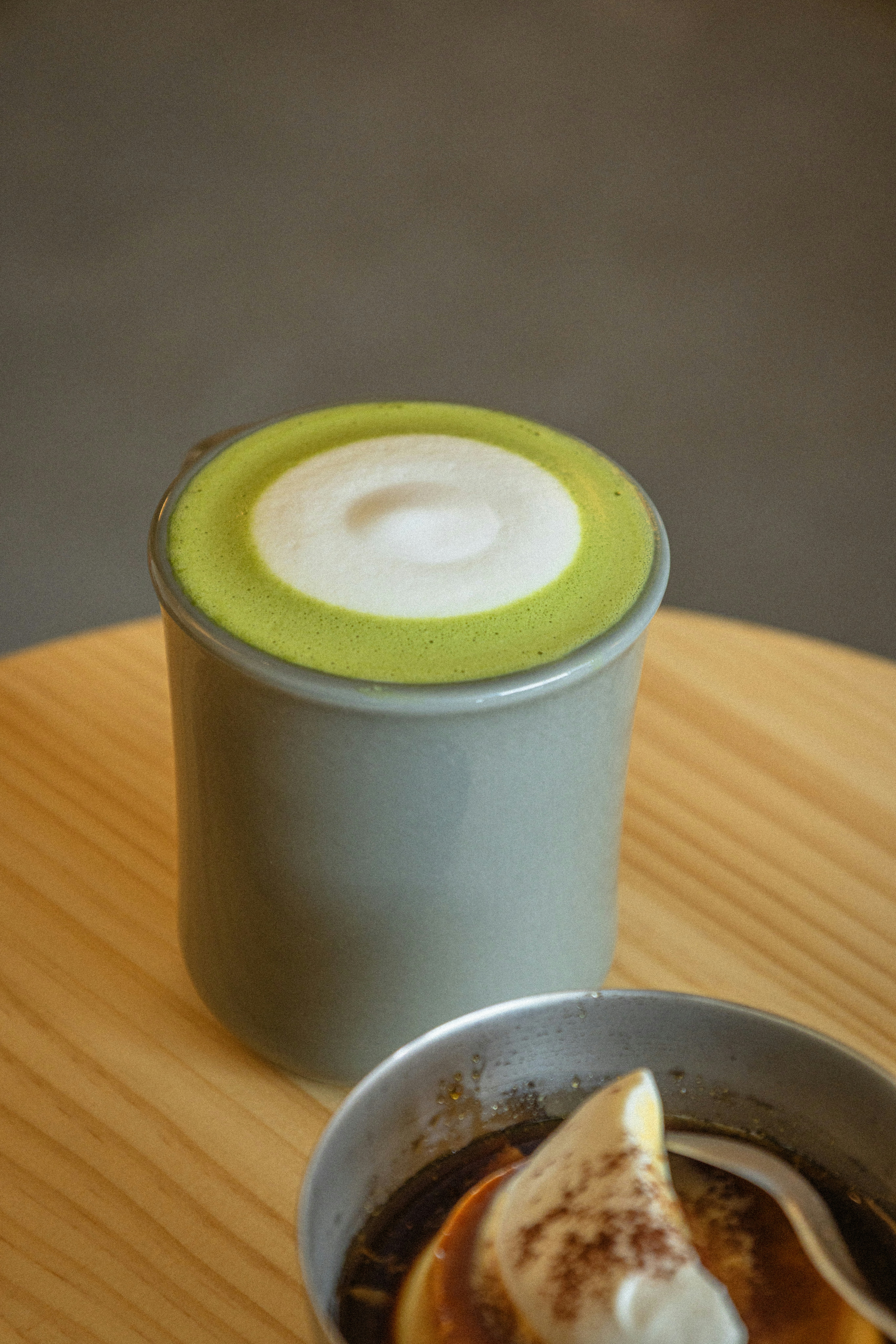 Matcha on the Edge: Velvety Cup with Creamy Swirl