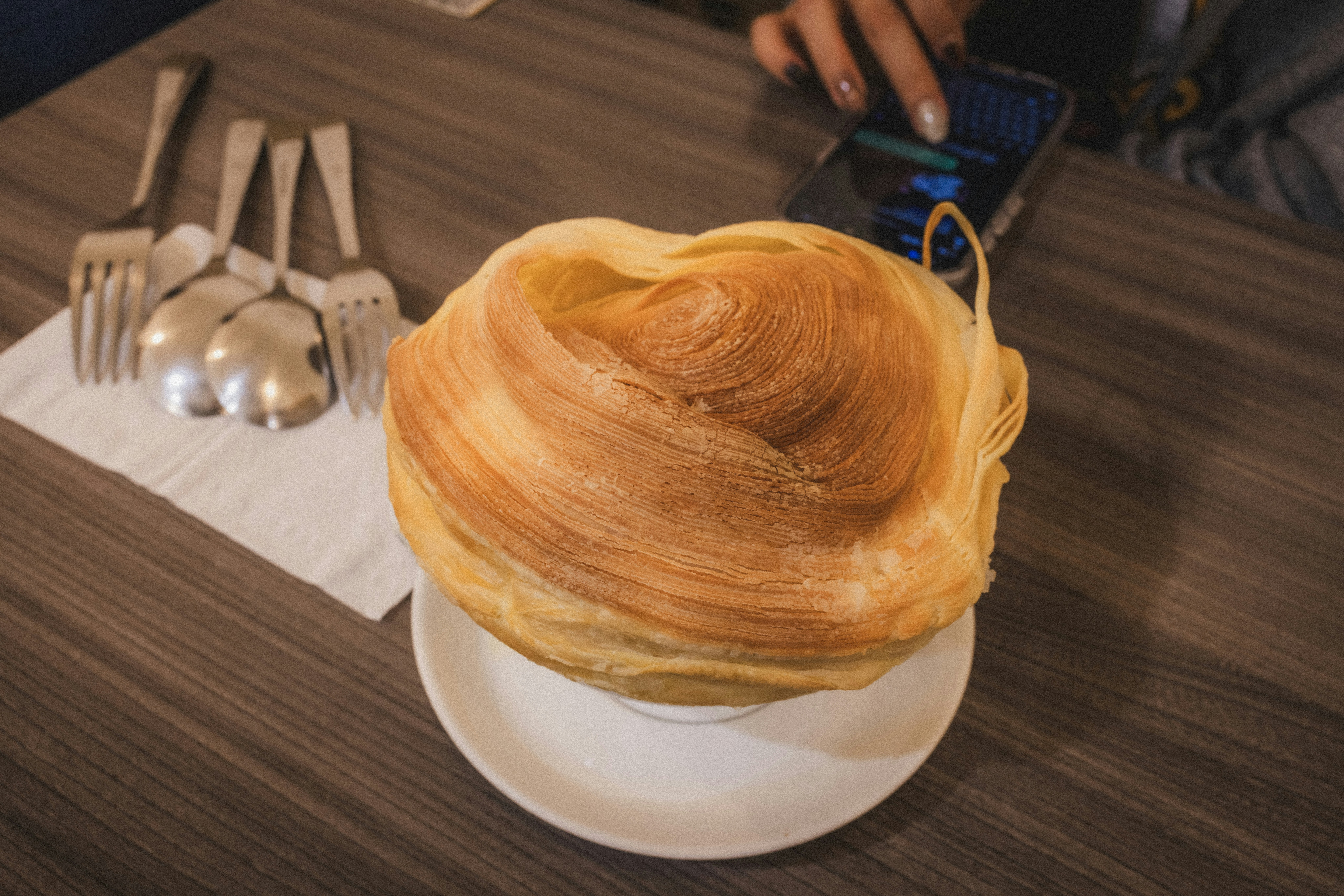 Butter Layered Pastry Crown on a White Plate
