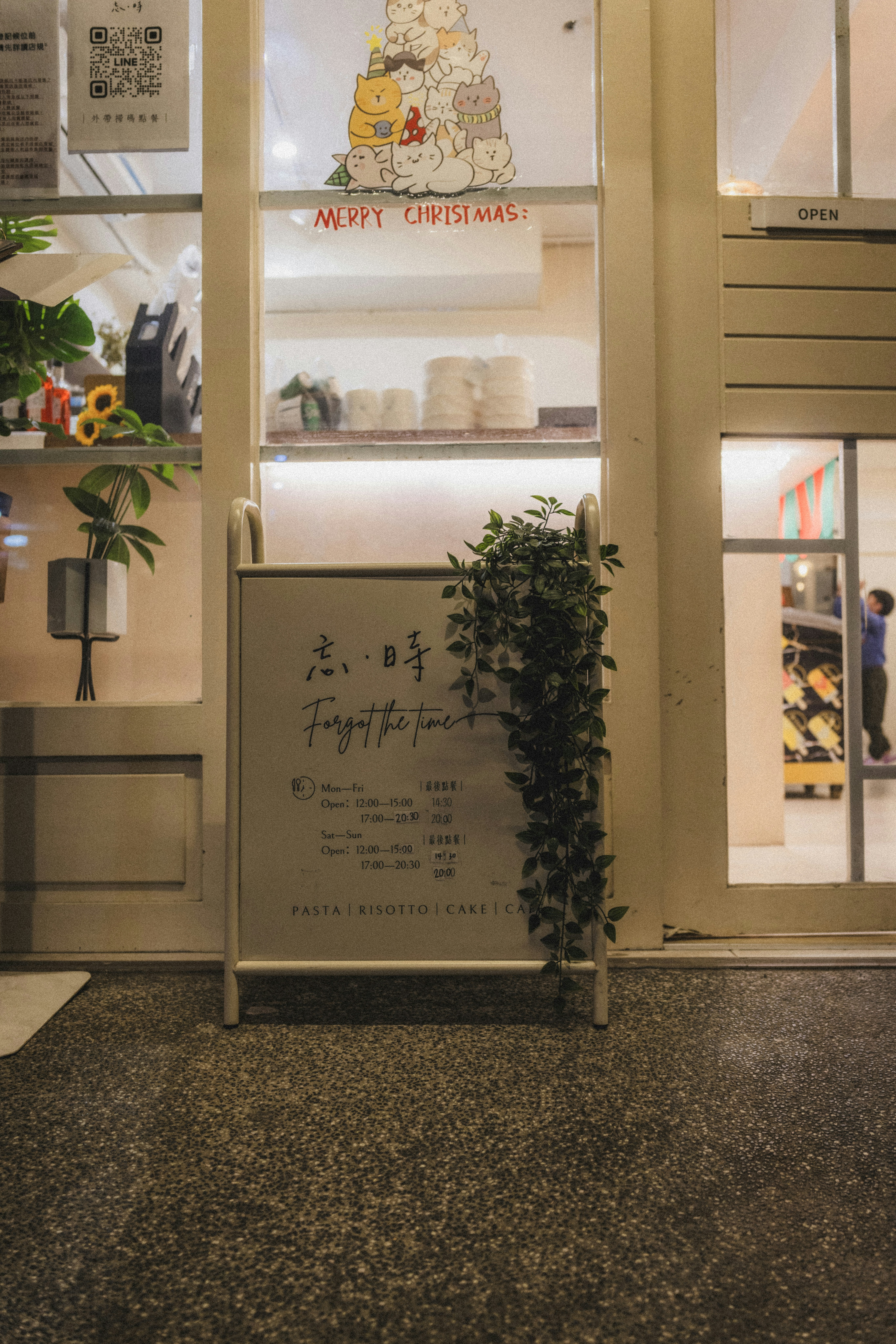 Holiday Window Glow: Quiet Café Exterior in Warm Light