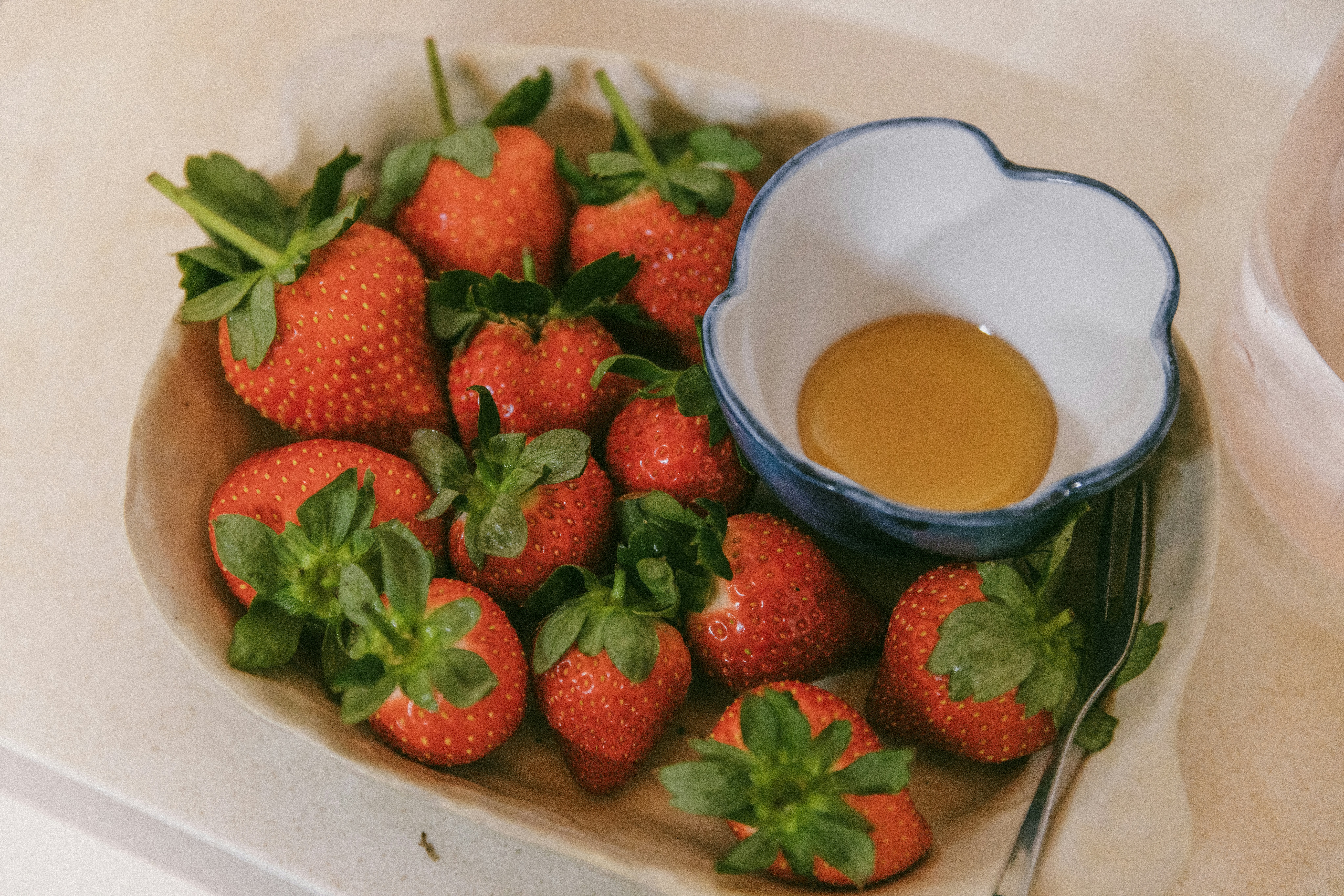 Strawberry Cluster with a Dip of Honey in a Petite Blue Bowl