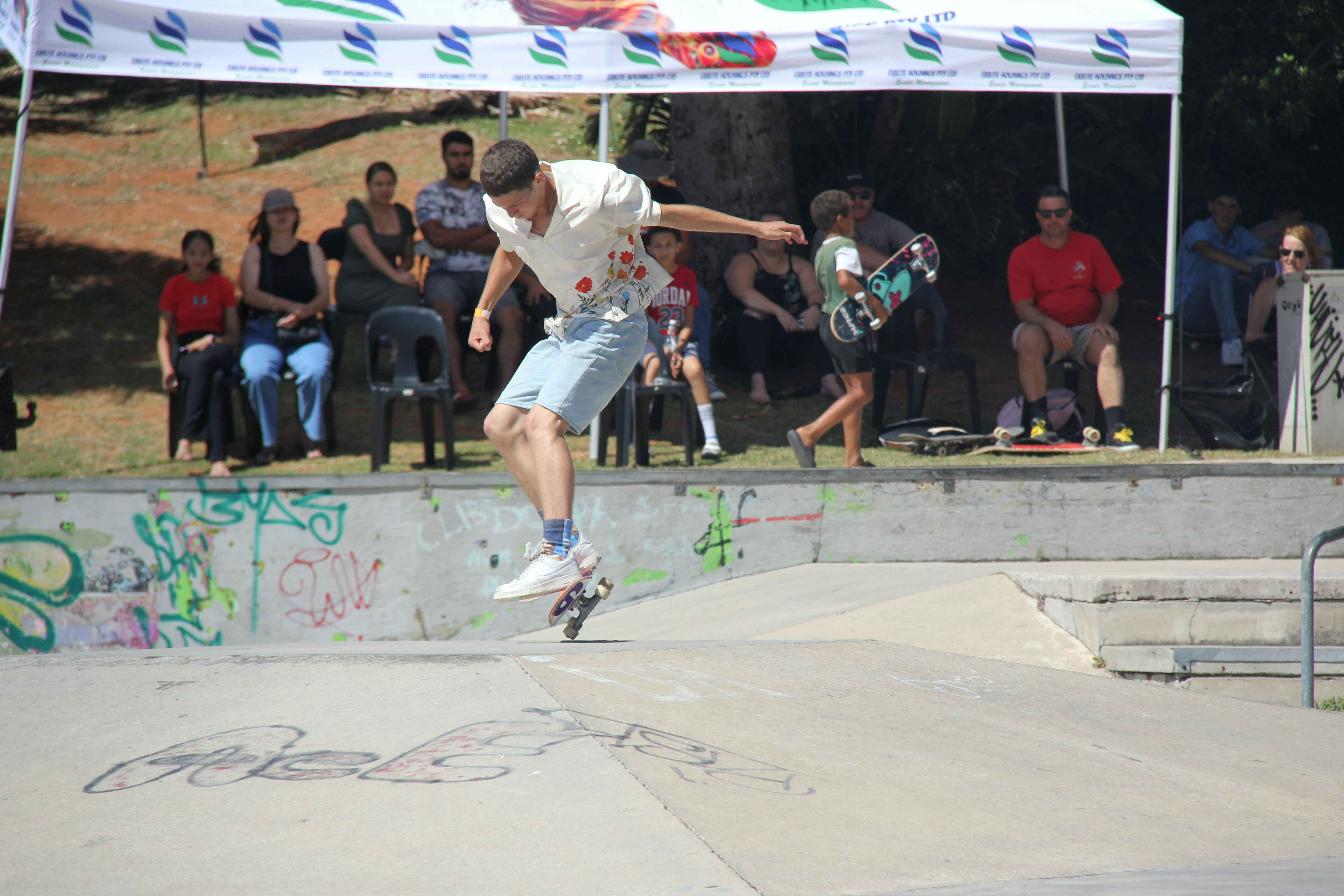 Mid-Flight Skate Trick Under the Tented Viewing Arch