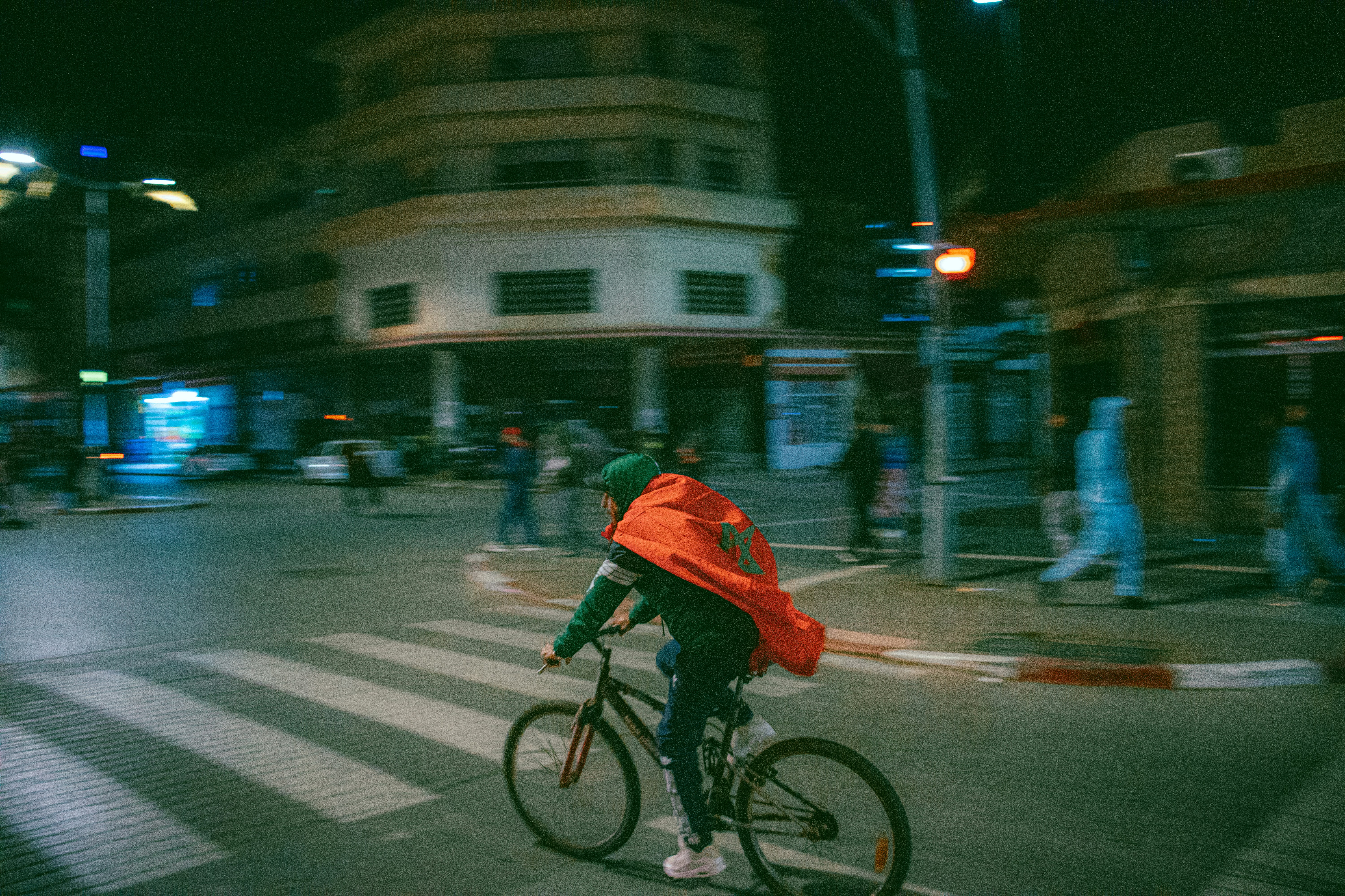 Urban courier on a neon-lit night ride