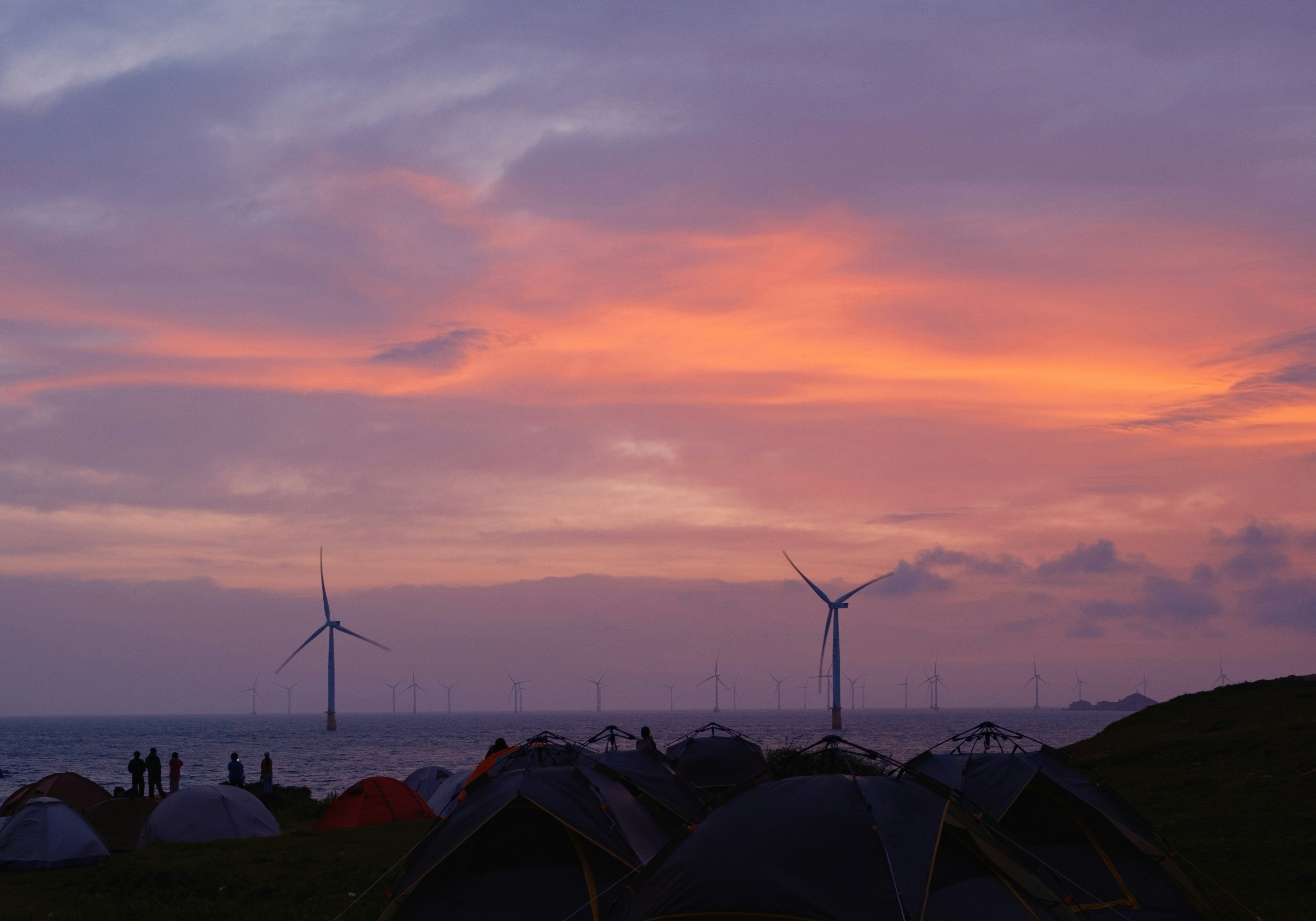 Sunset Campsites and Wind Turbines at Dusk