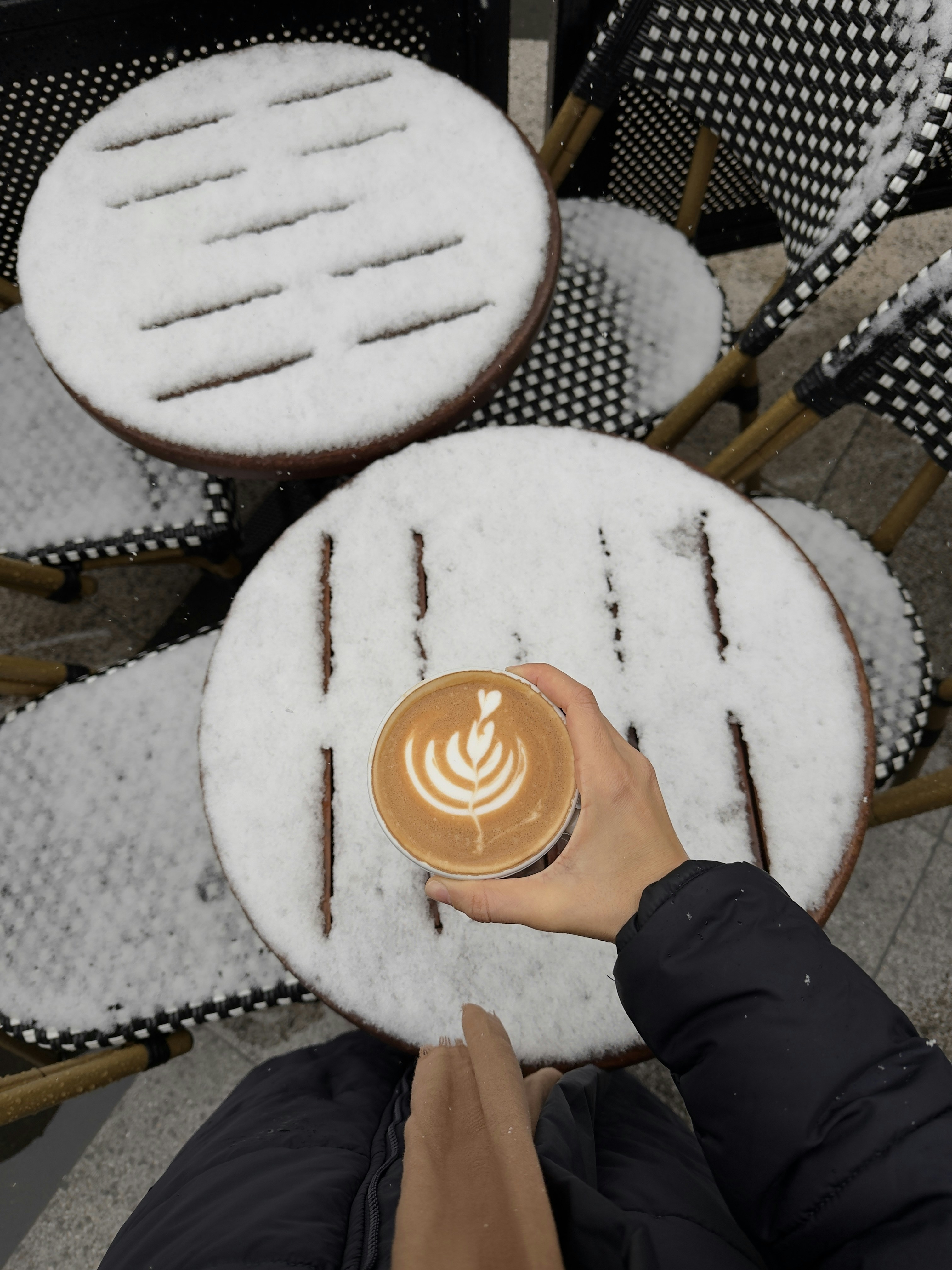 Snow-kissed Café Moment: Latte Ring on Round Table