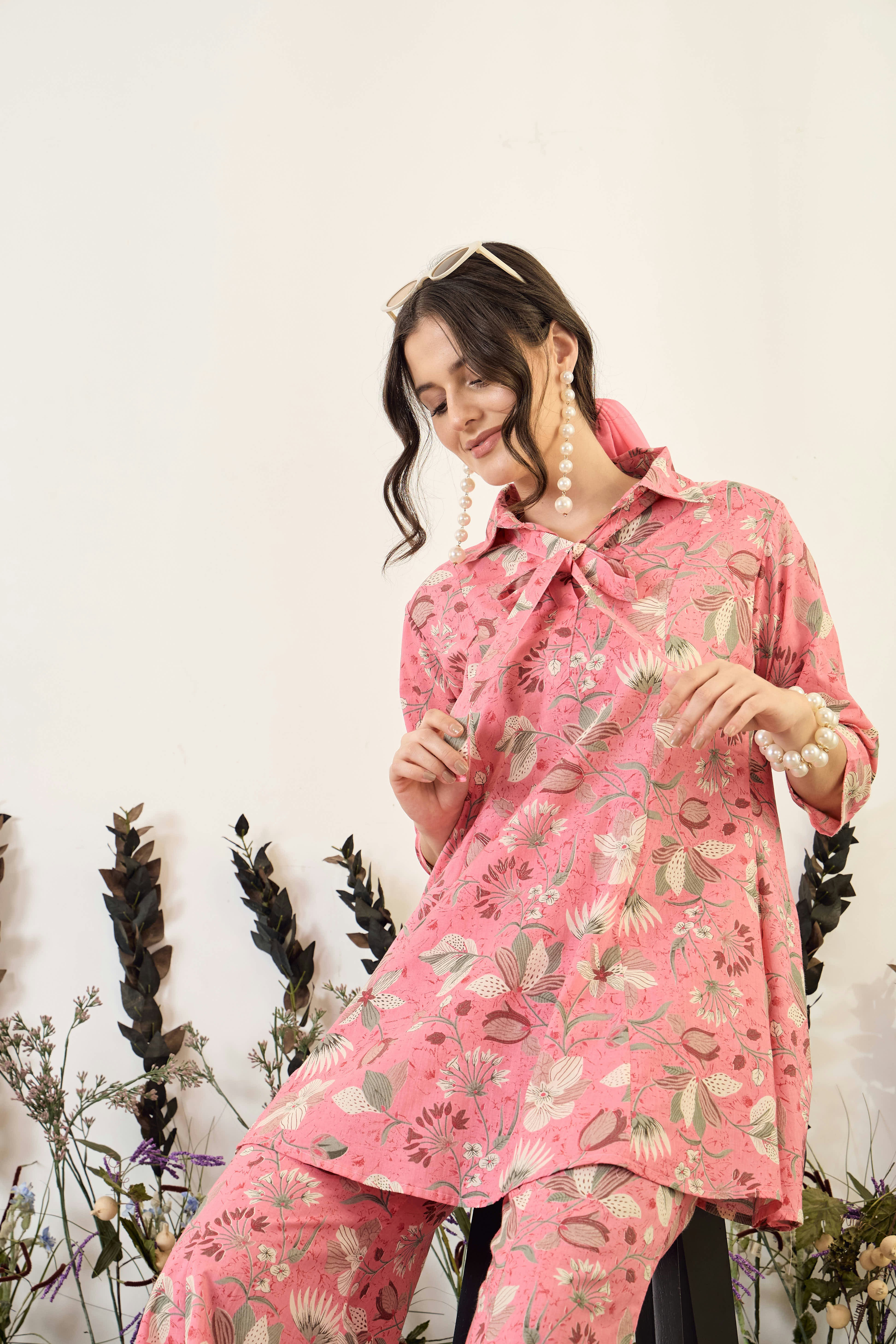 Floral Mock-Neck Ensemble: Soft Pastels and Pearl Accents