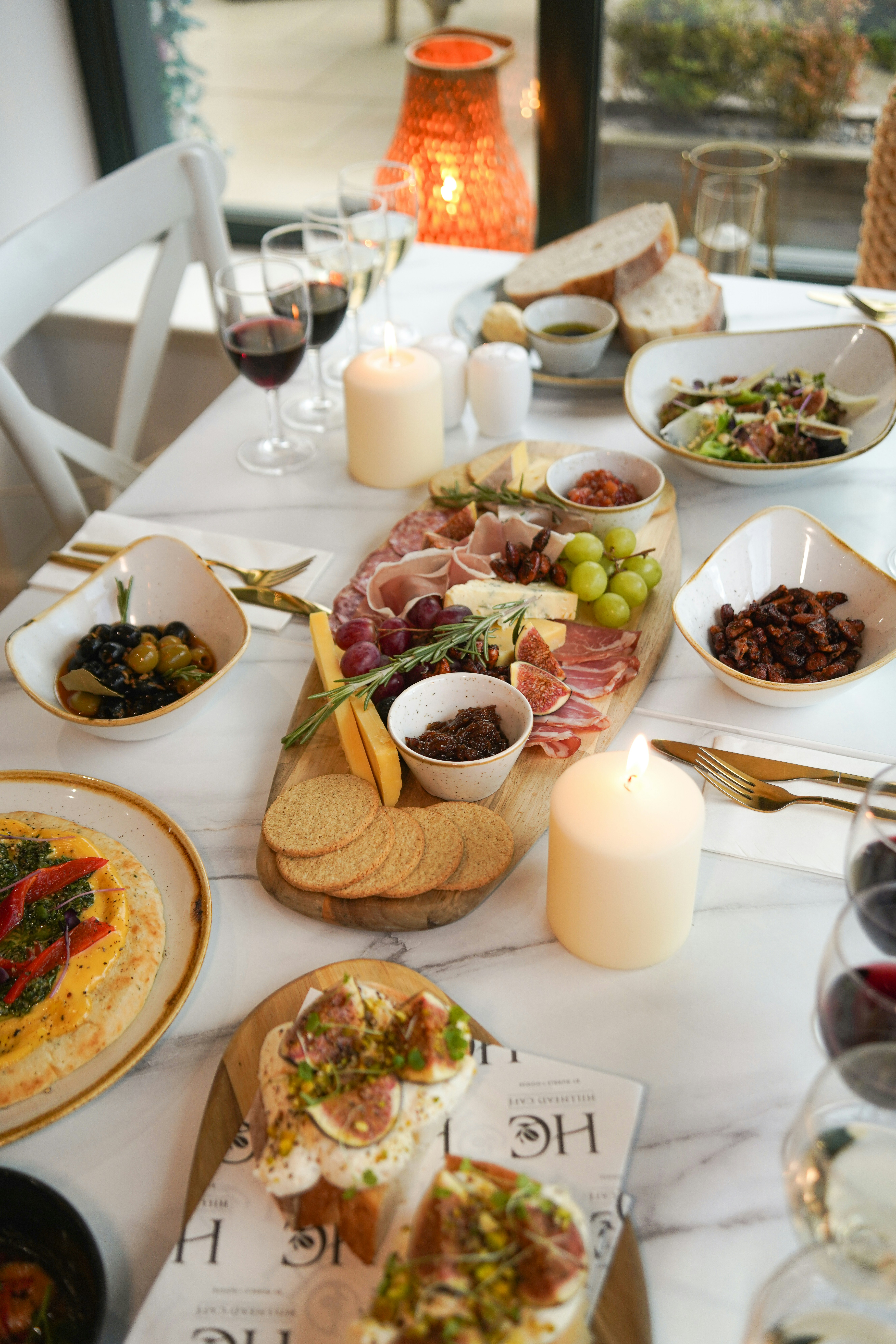 Sumptuous Charcuterie Spread on a Sunlit Dinner Table