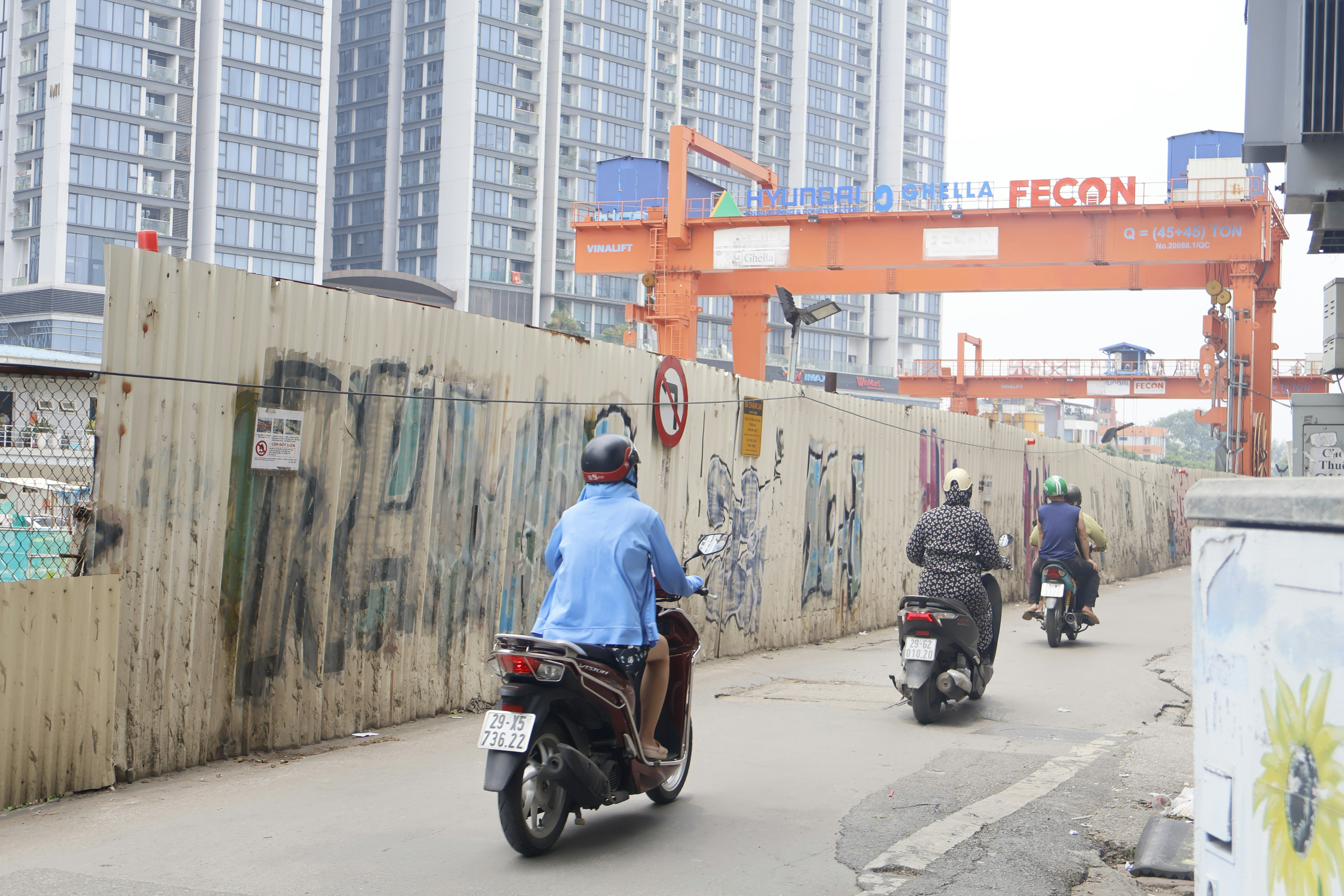 Heading Toward the Quiet Gate: Motorbikes Under a Construction Span