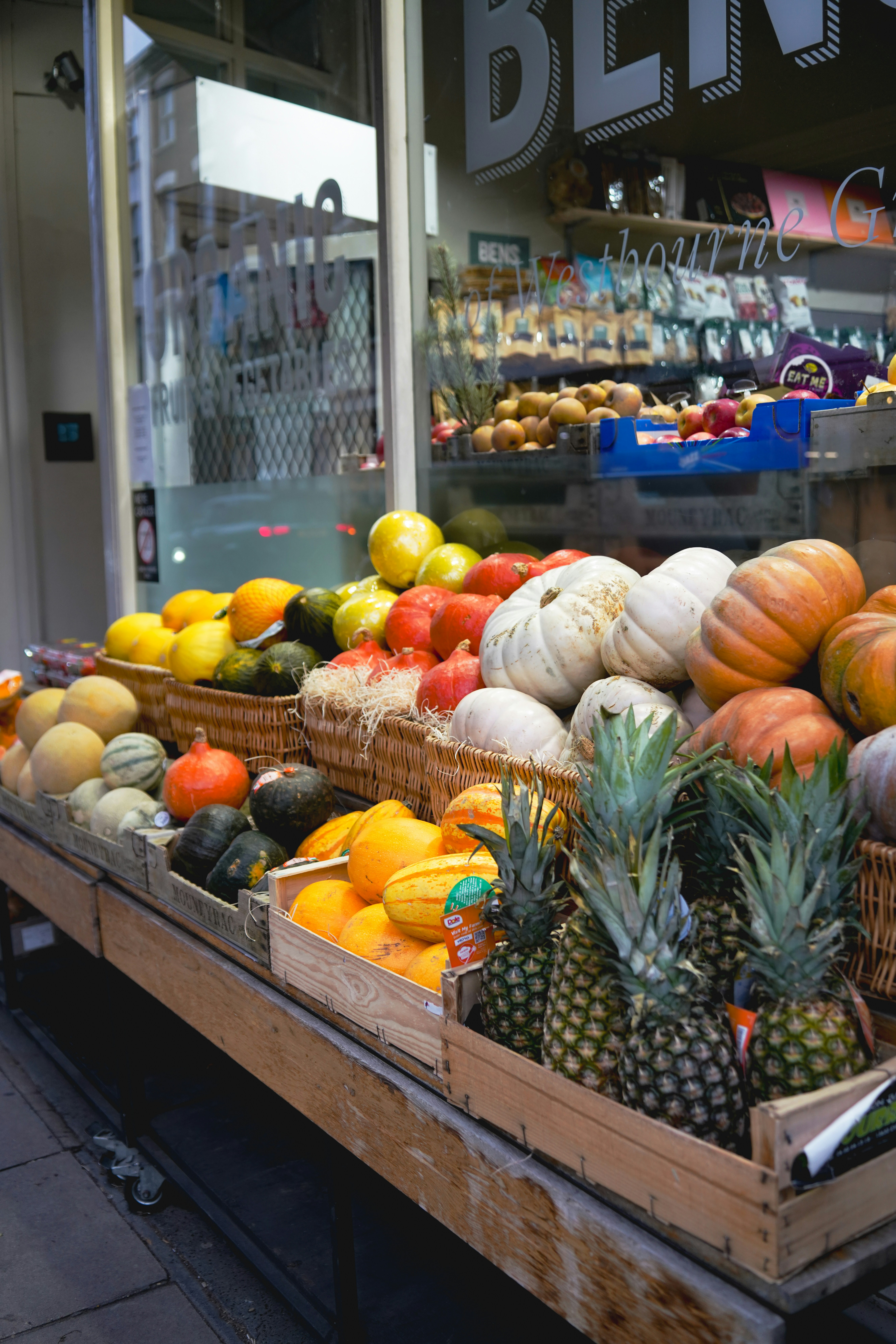 Fruit Stand Portrait: A Whimsical Bounty on a City Sidewalk