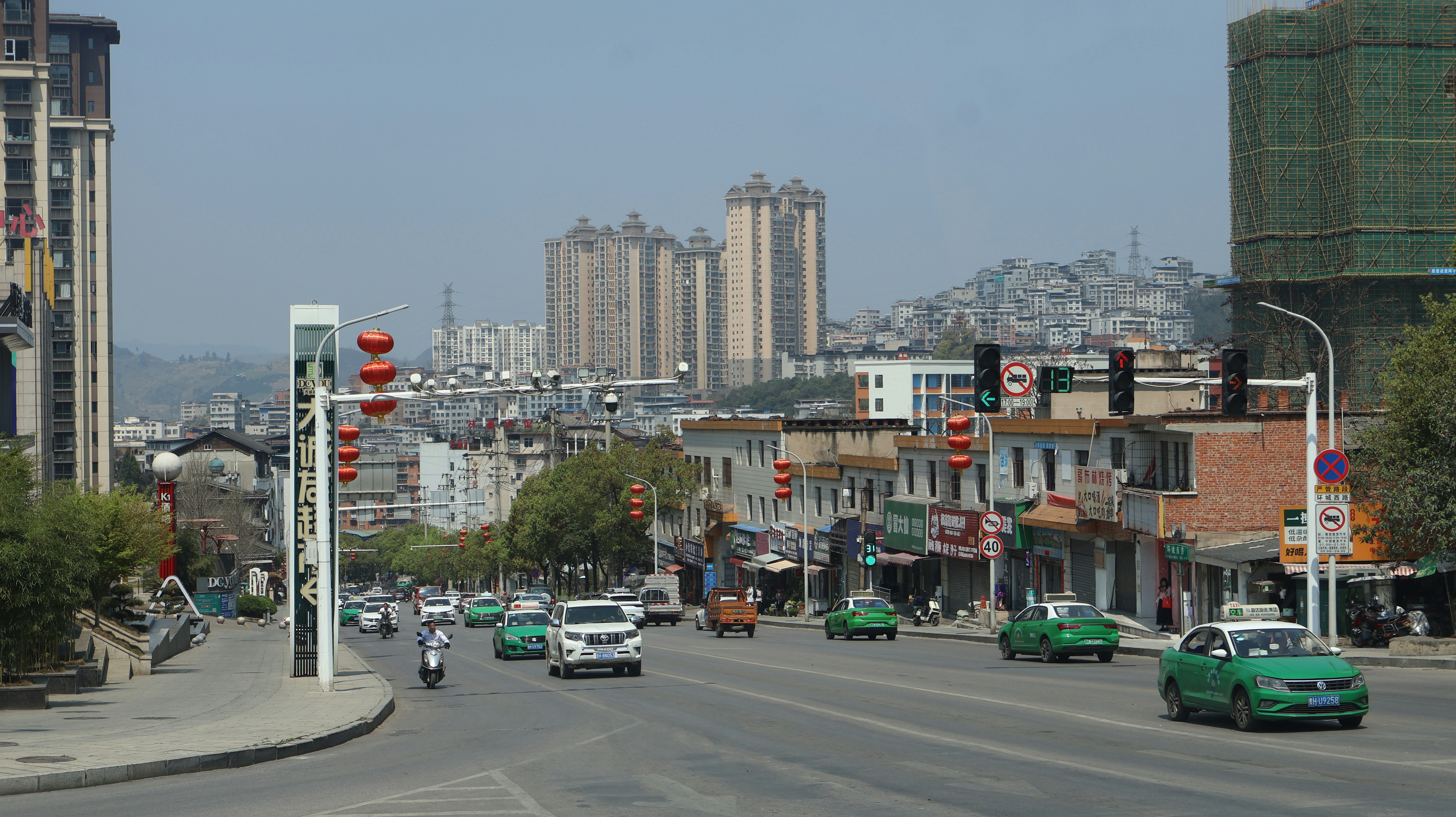 Urban Confluence: City Street with Distant High-Rises