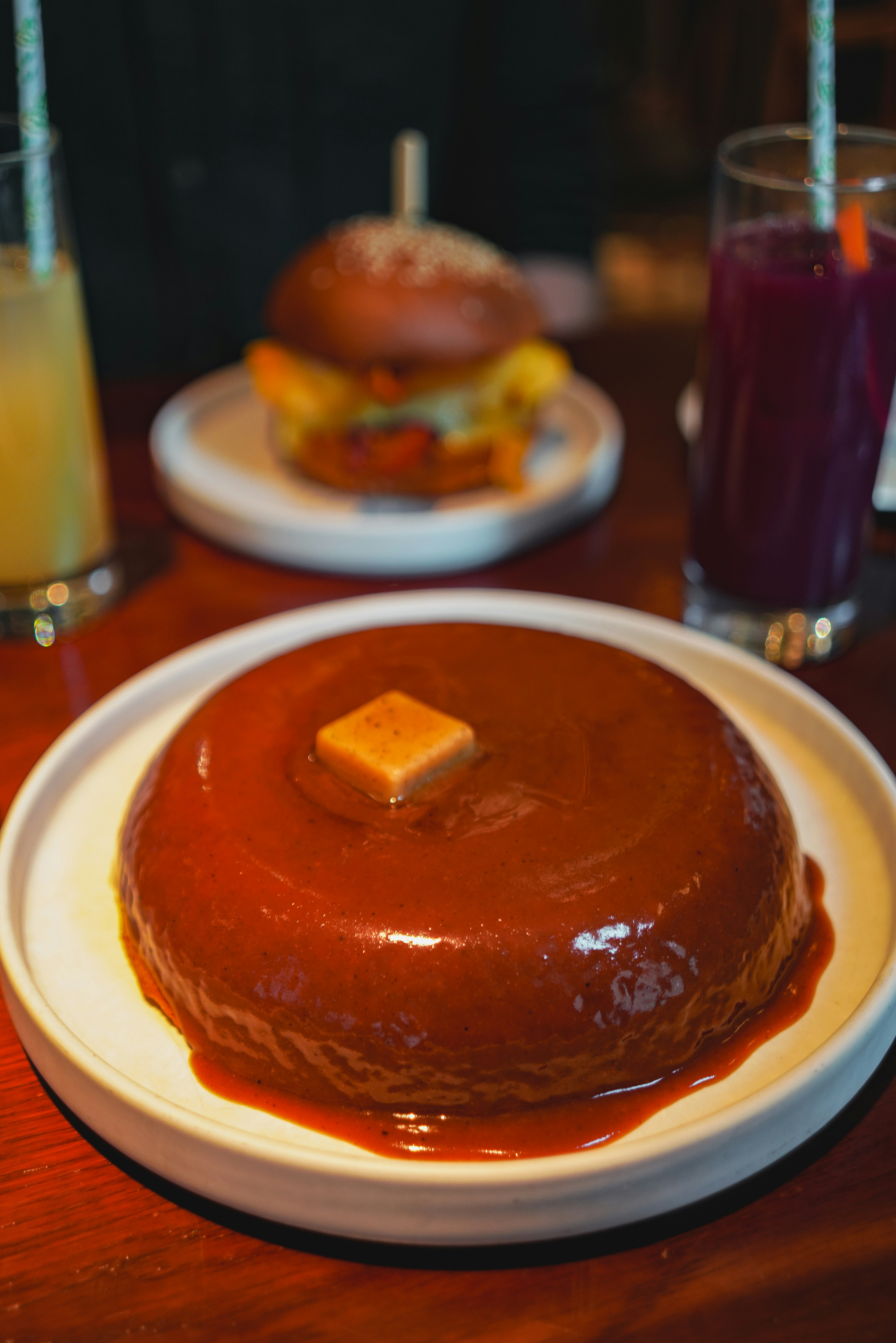 Caramel Crown: A glossy pudding with a pat of butter