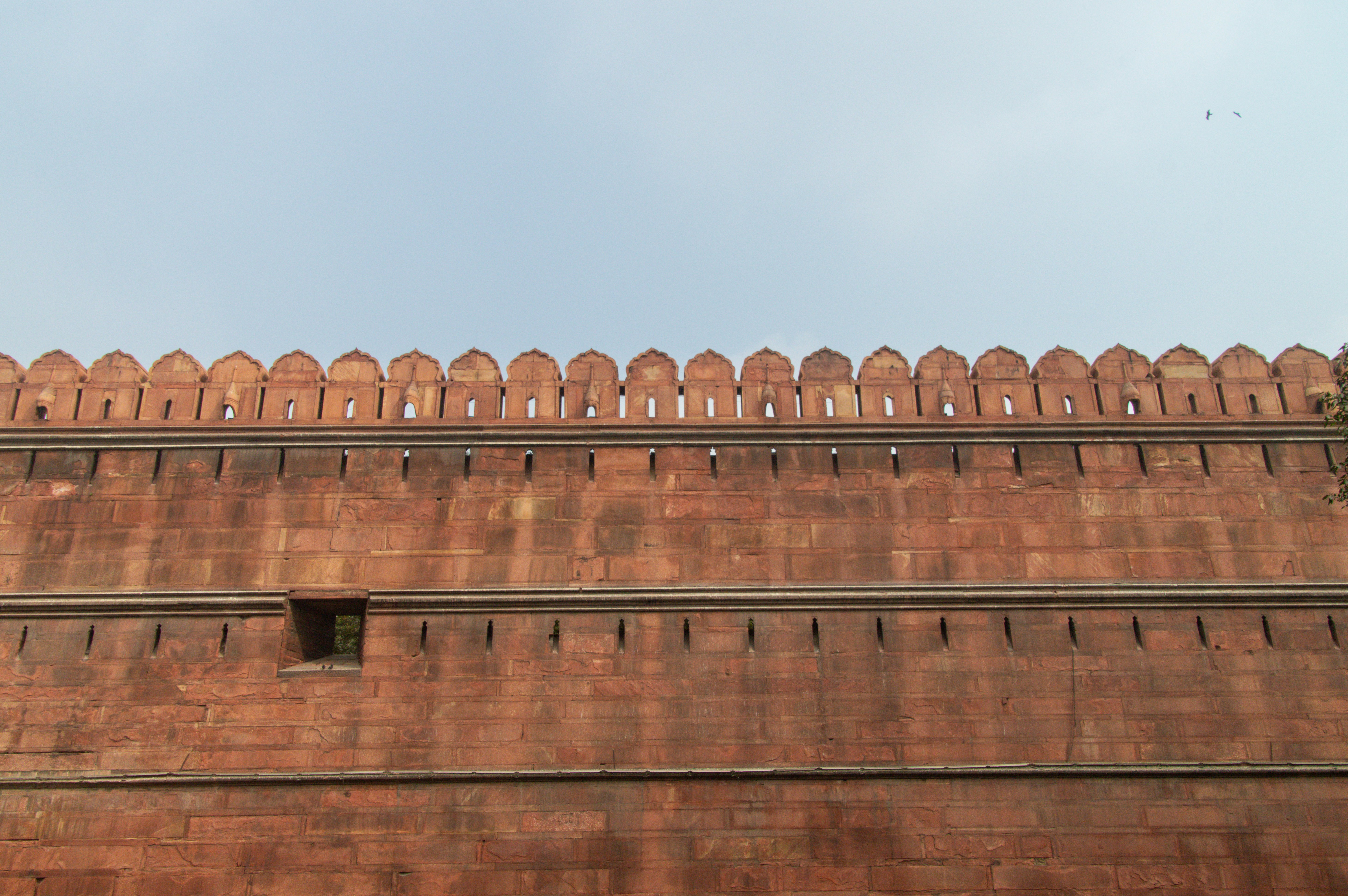 Brickwork Crown: A Fortified Skyline Above the Parapet