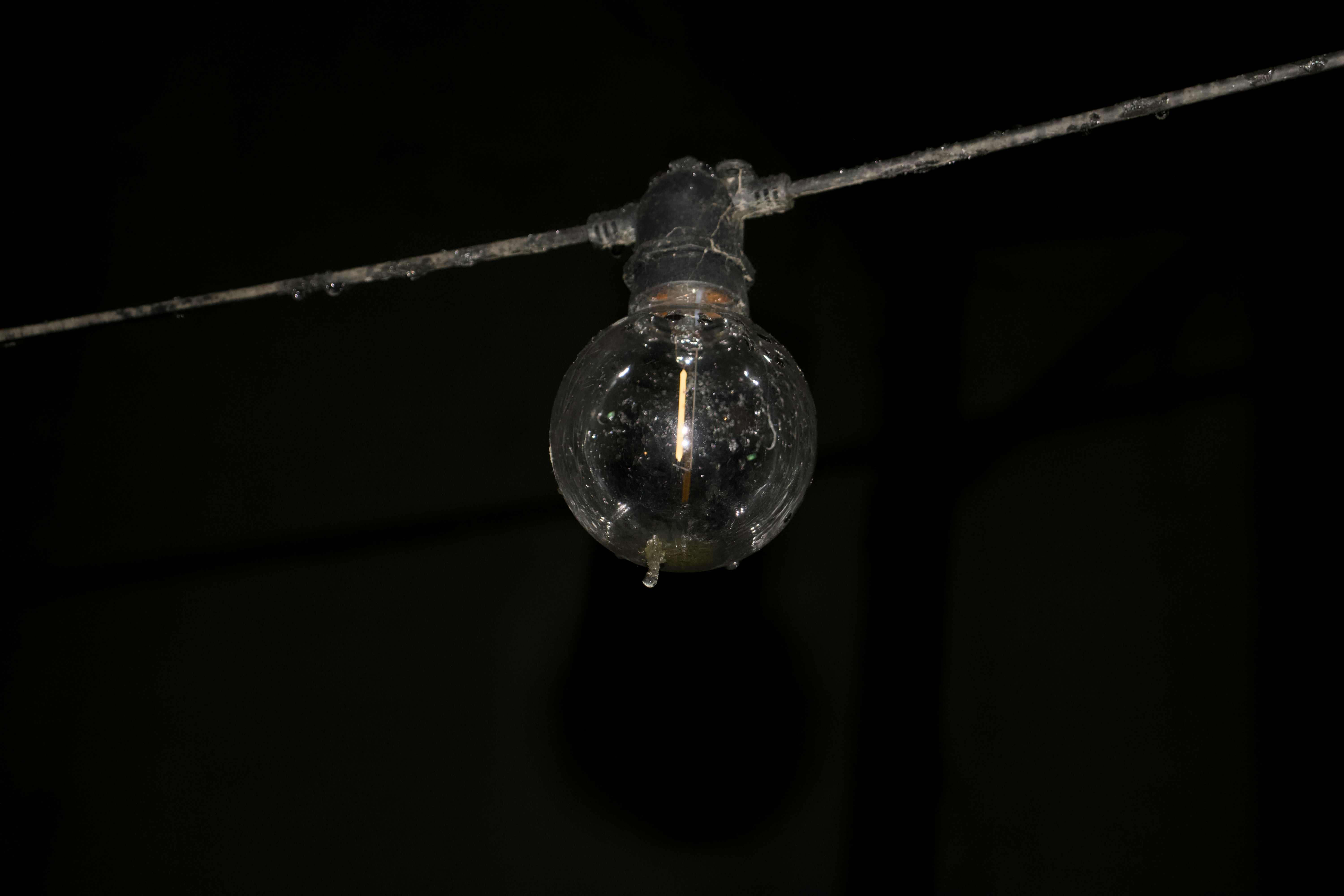 Dim Bulb on a Quiet Wire: A Nighttime Lonely Glow