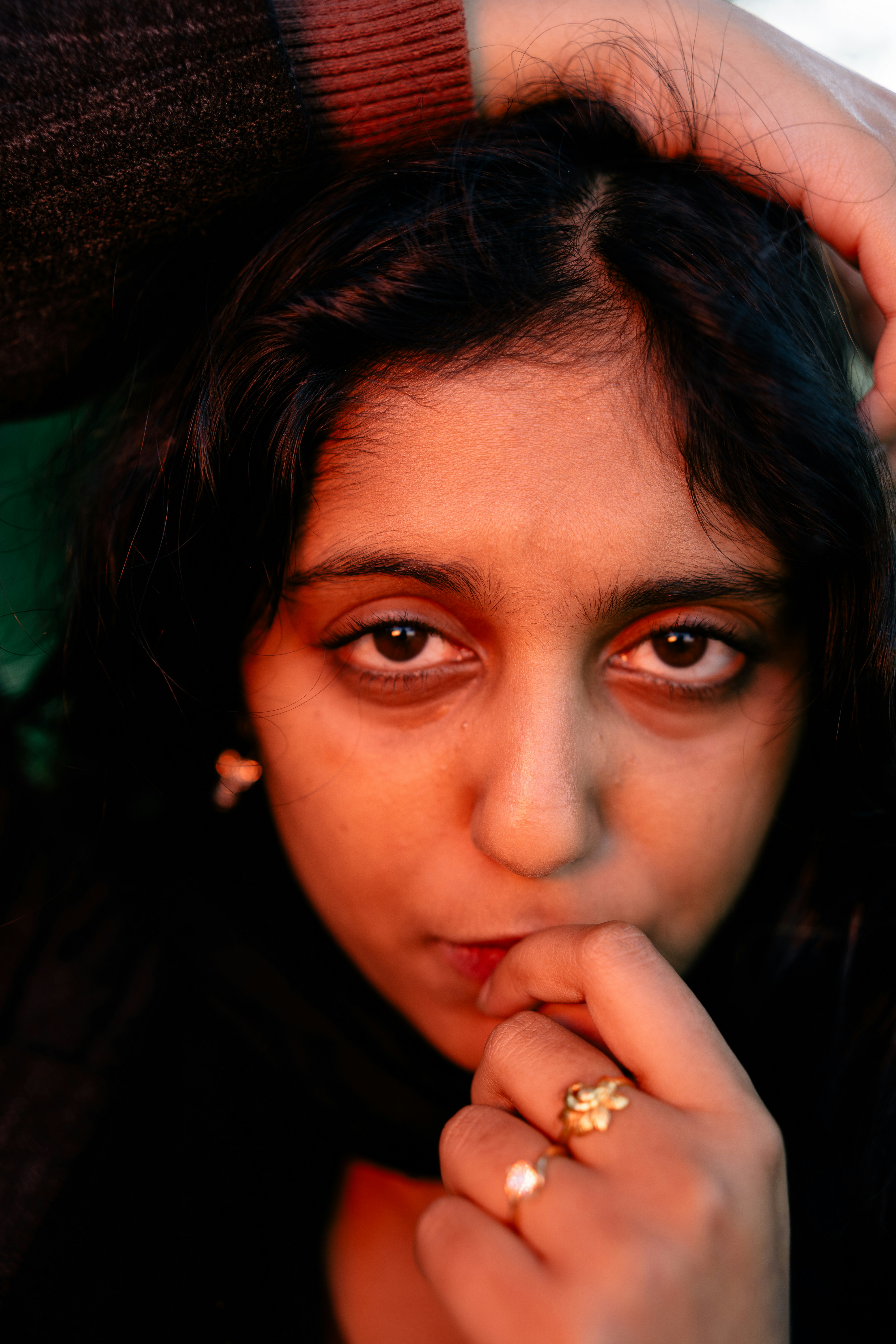 Close-Up of Focused Gaze and Subtle Gesture