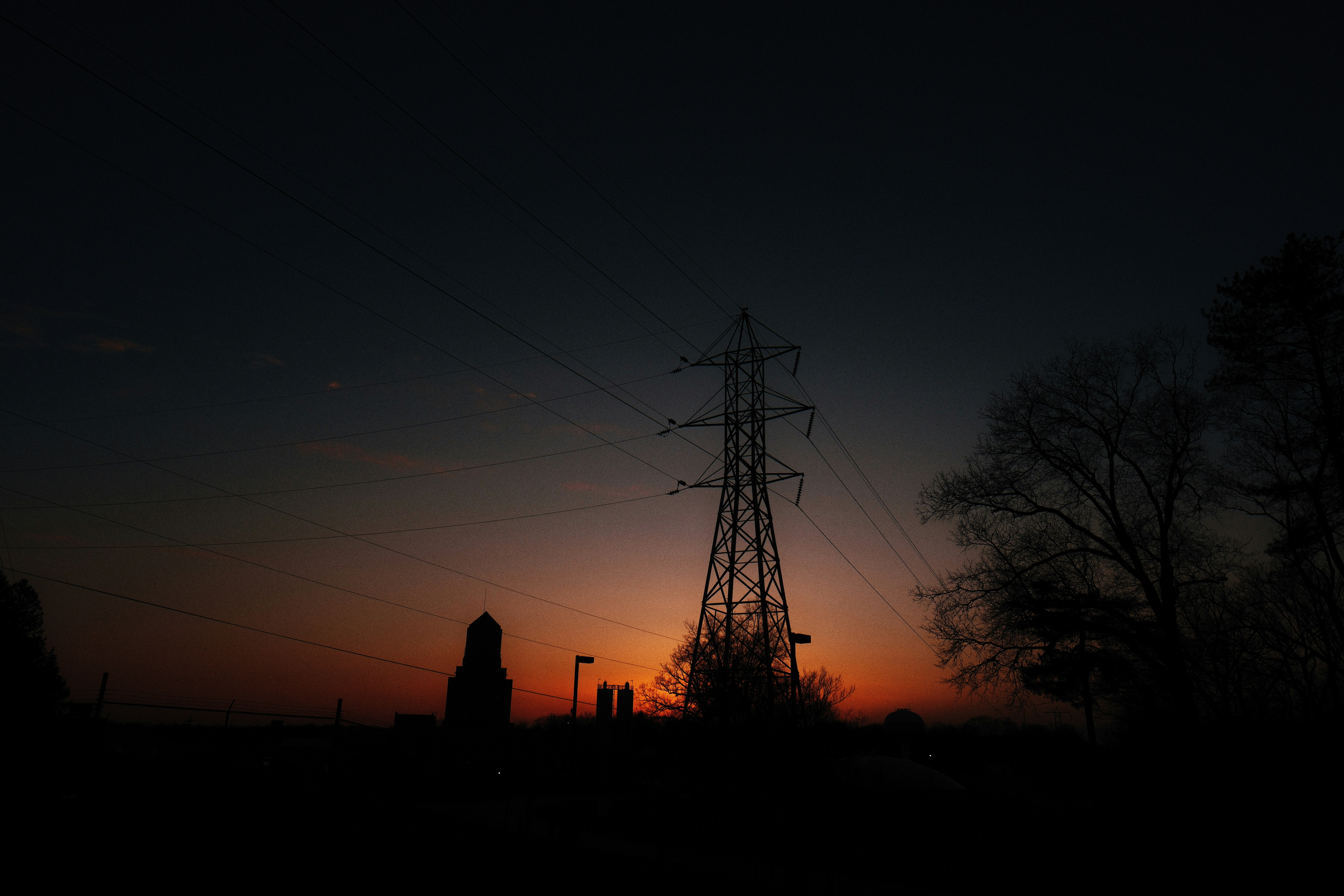 Silhouetted Horizon Under a Lithium-Lantern Sky
