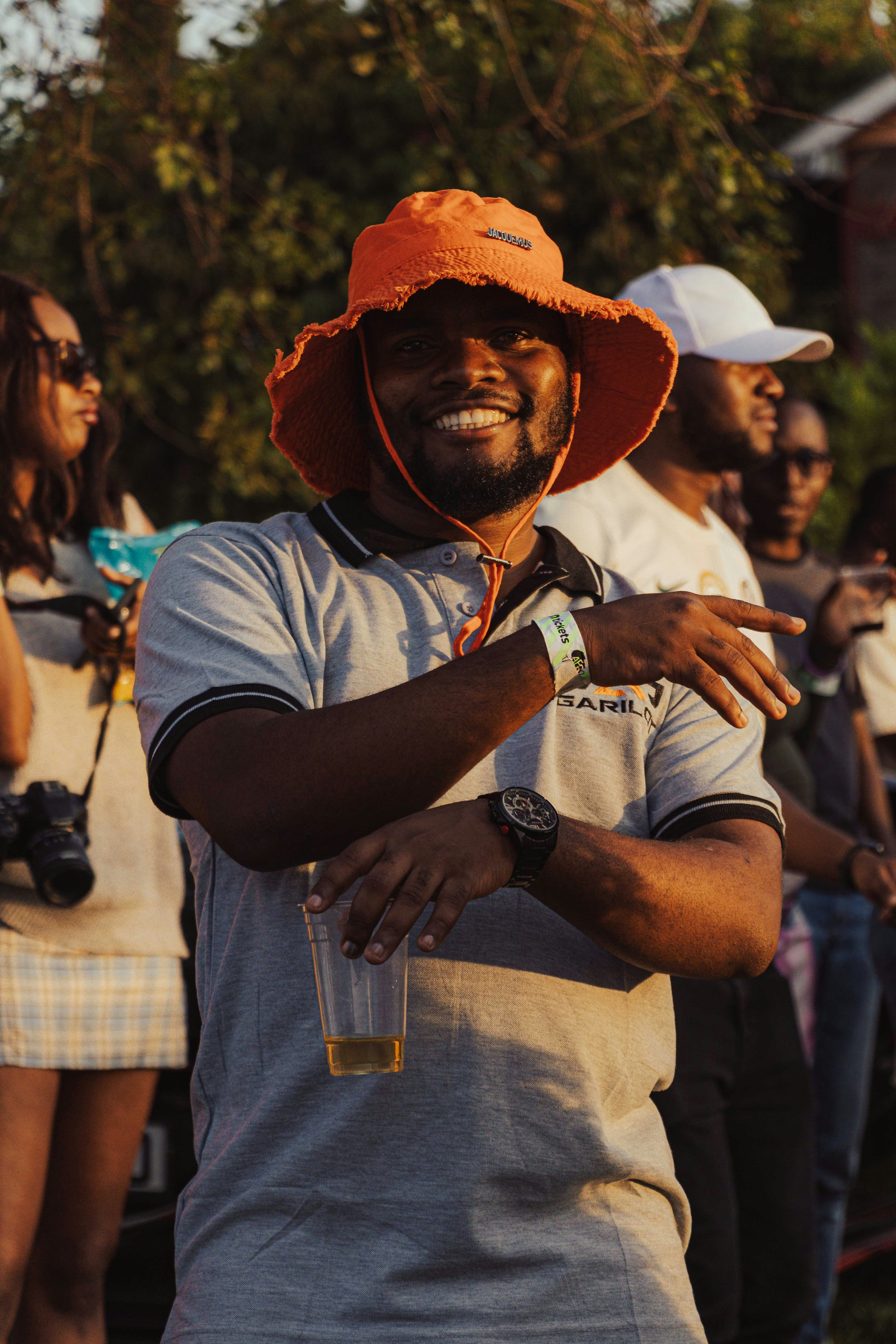 Warmth in the Crowd: The Man with the Orange Hat Lead