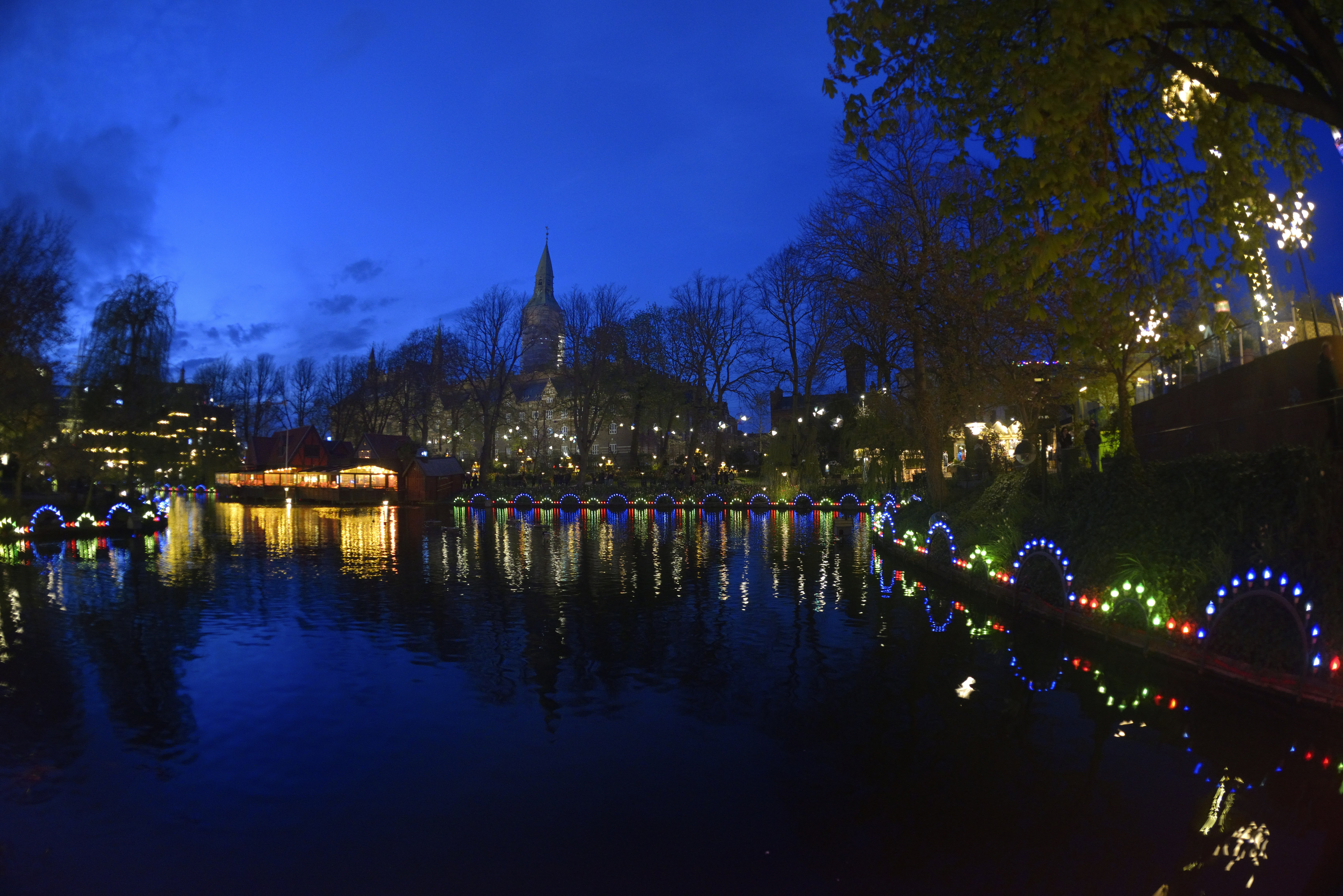 Midnight Canal of Lights: A Cityscape in Blues and Oranges