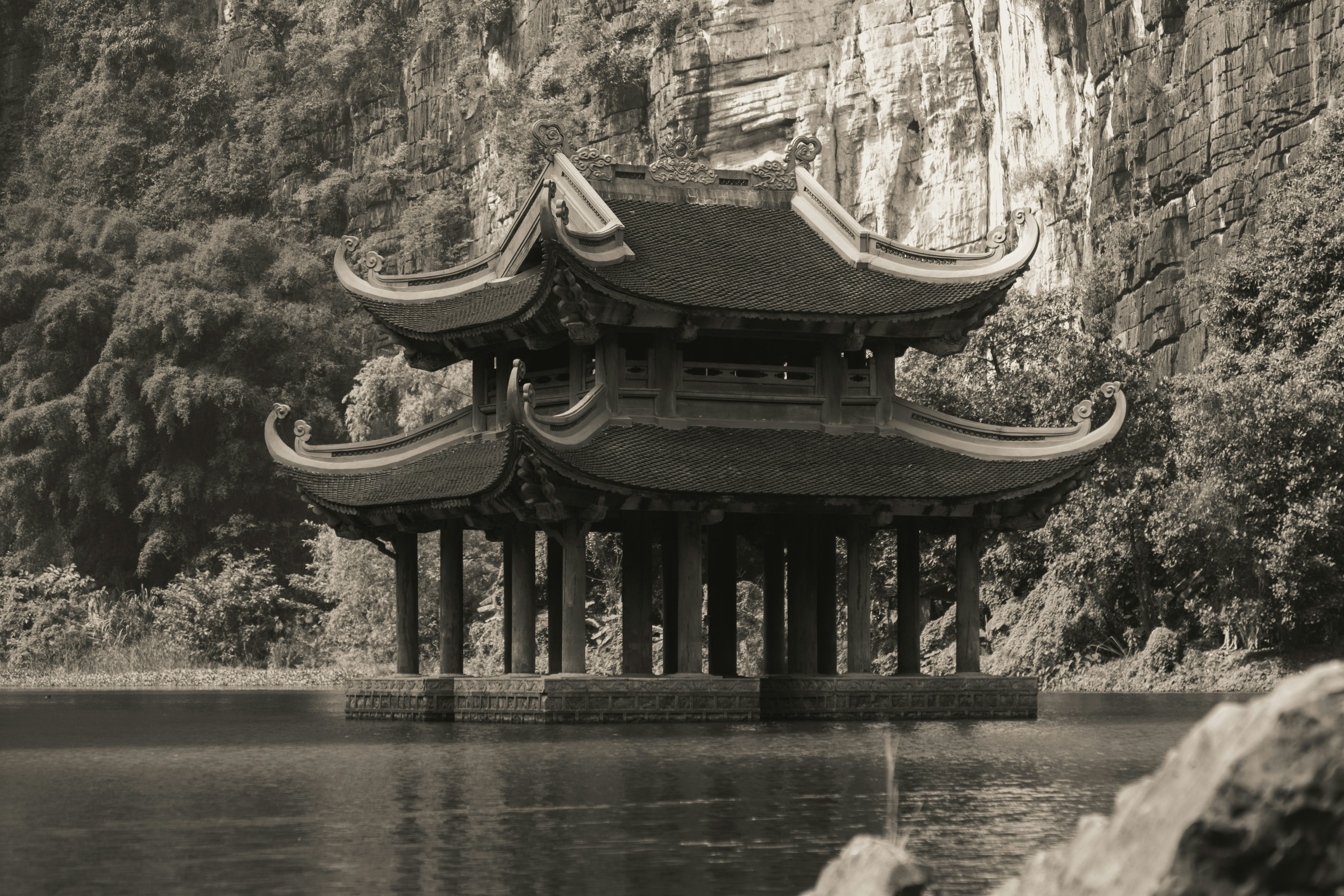Temple by the Water: A Serene Pagoda Amid Still Reflections