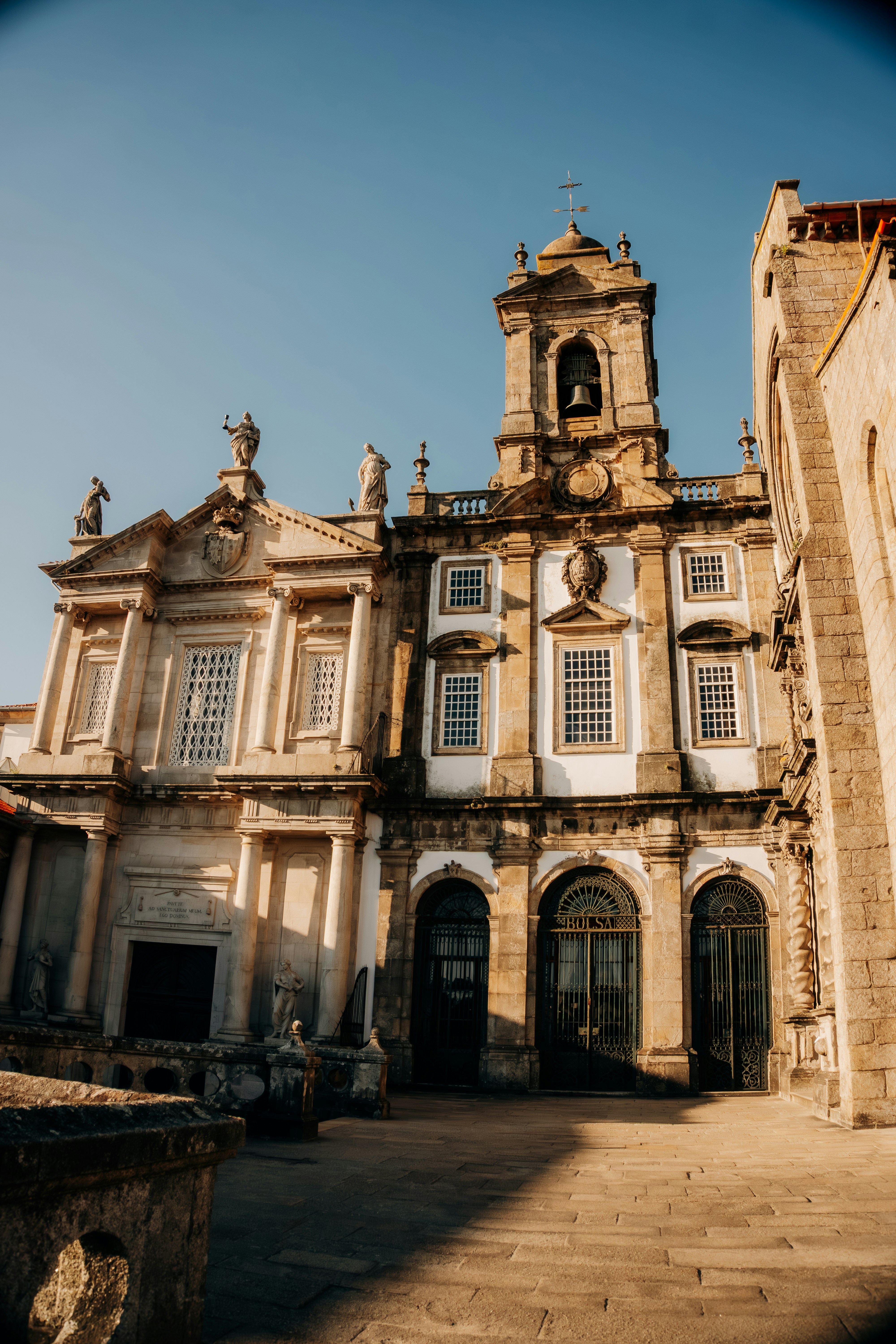 Sunlit Facade of a Historic Cathedral Courtyard