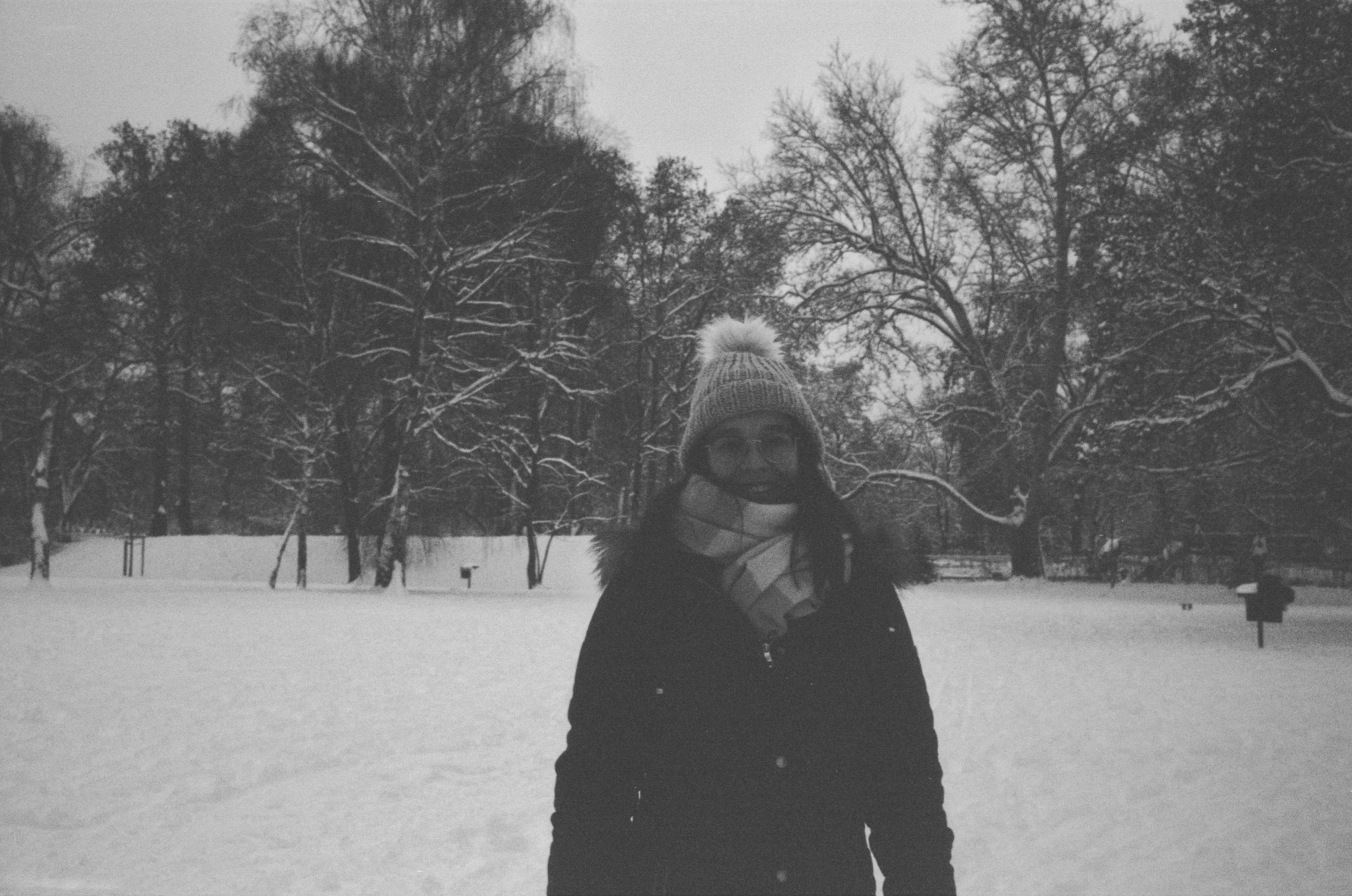 A woman in a snowy park wearing a winter hat. photo – Free Winter Image ...