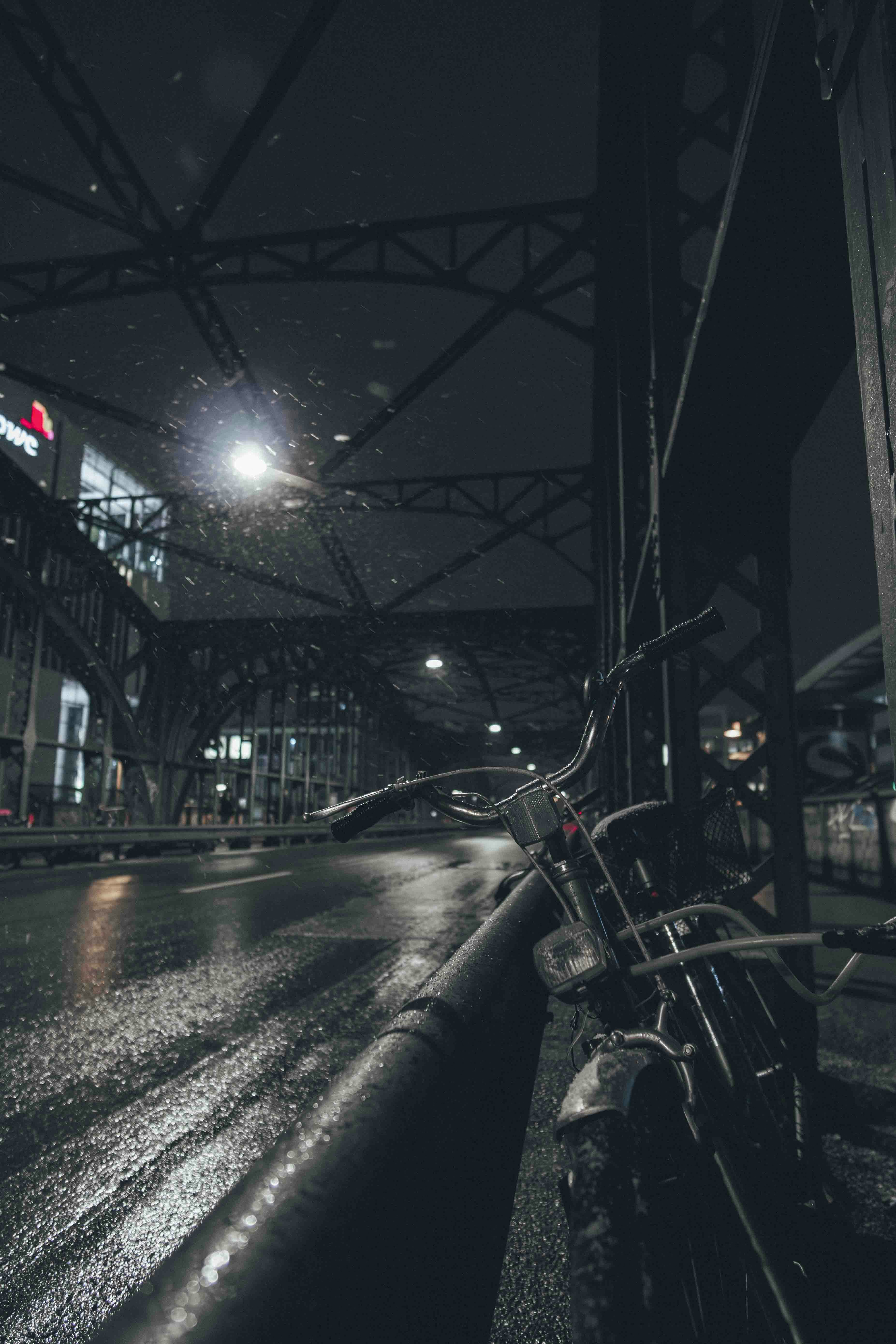 Nocturnal Rails: Bicycle Rest Under Neon Skies