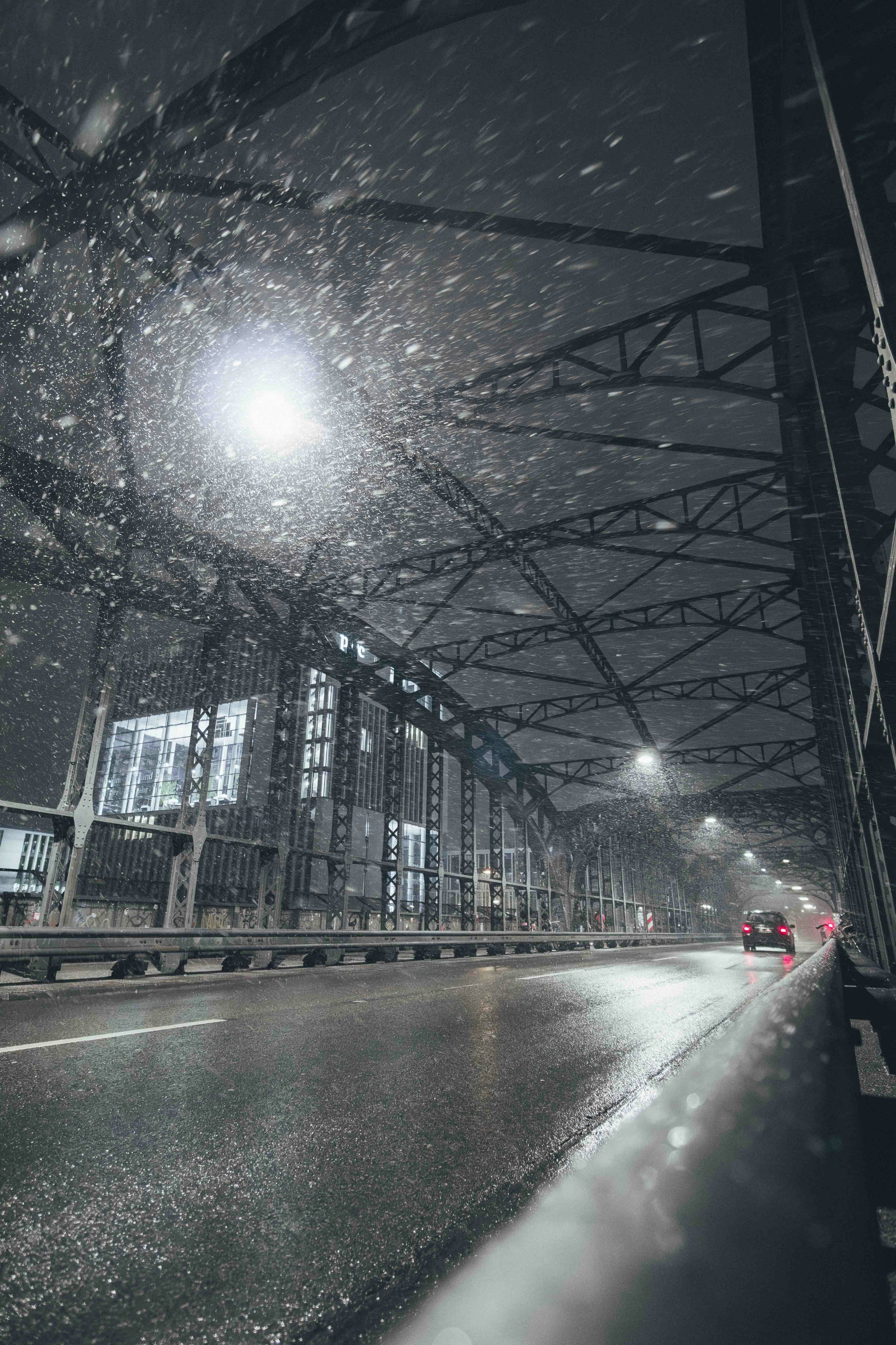 Snowfall on the Night Bridge: Neon Rain over Steel