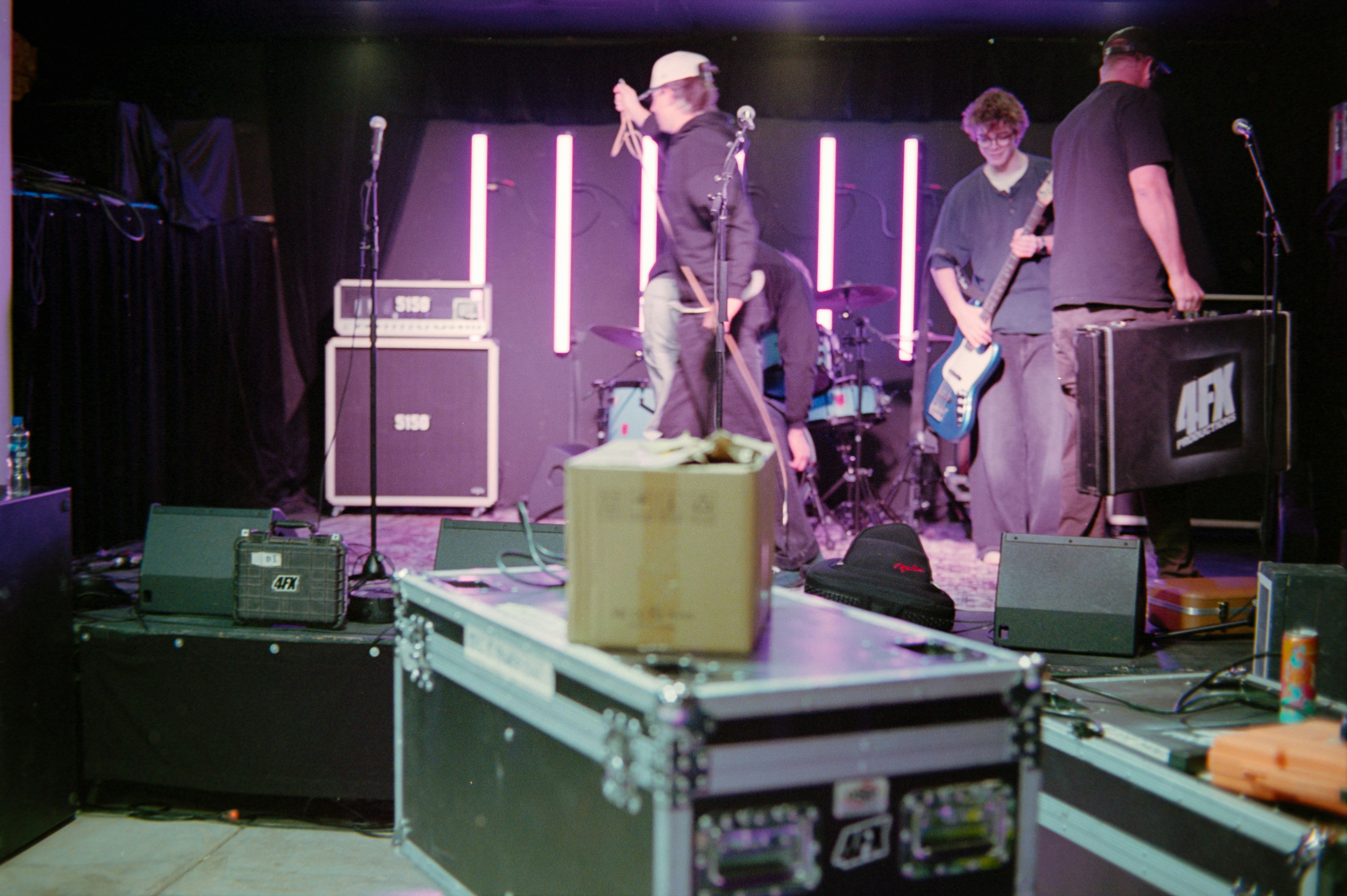 Band setting up equipment on a stage photo – Free Guitar Image on Unsplash