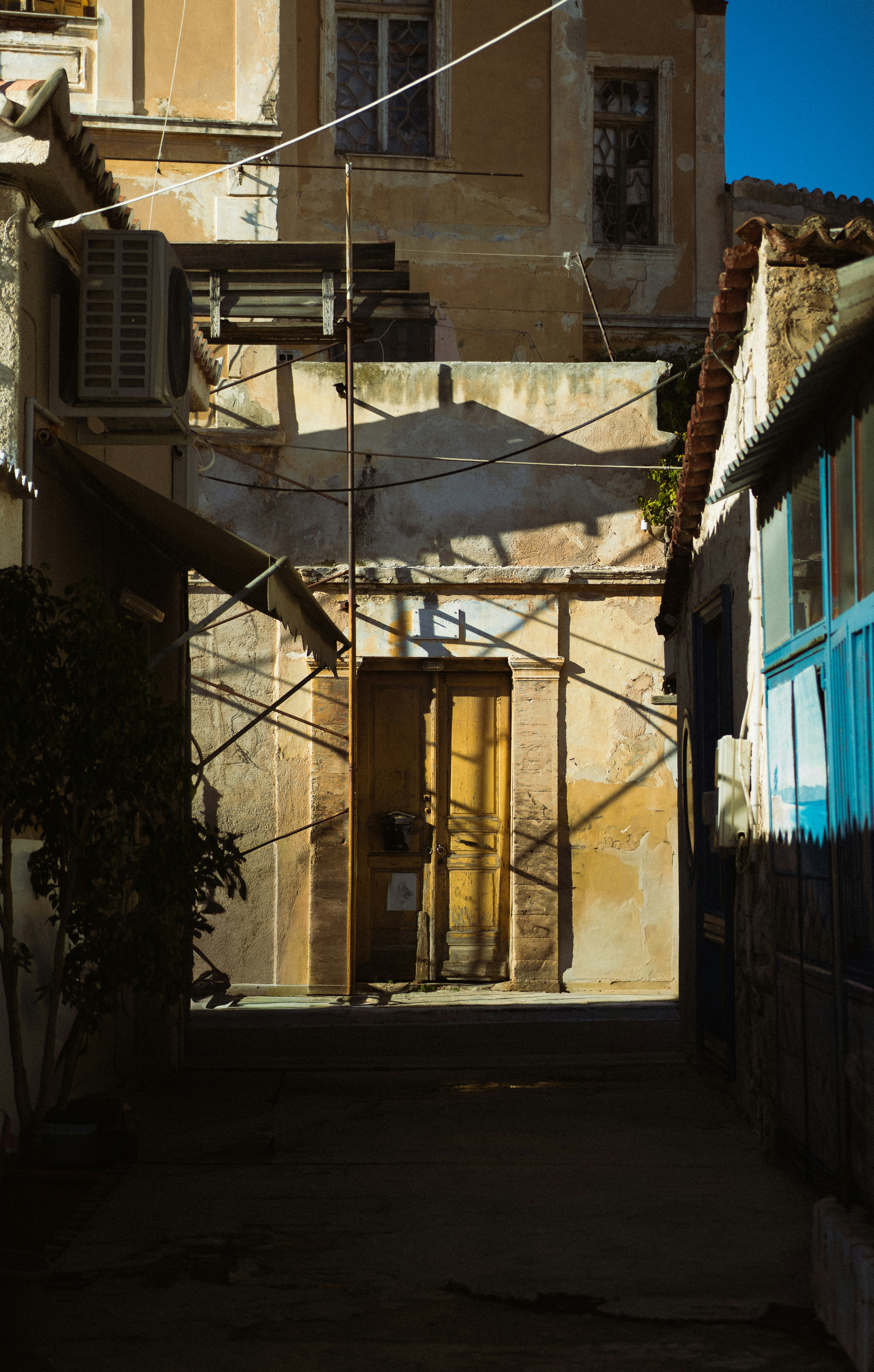 Sunlit doorway in a weathered courtyard